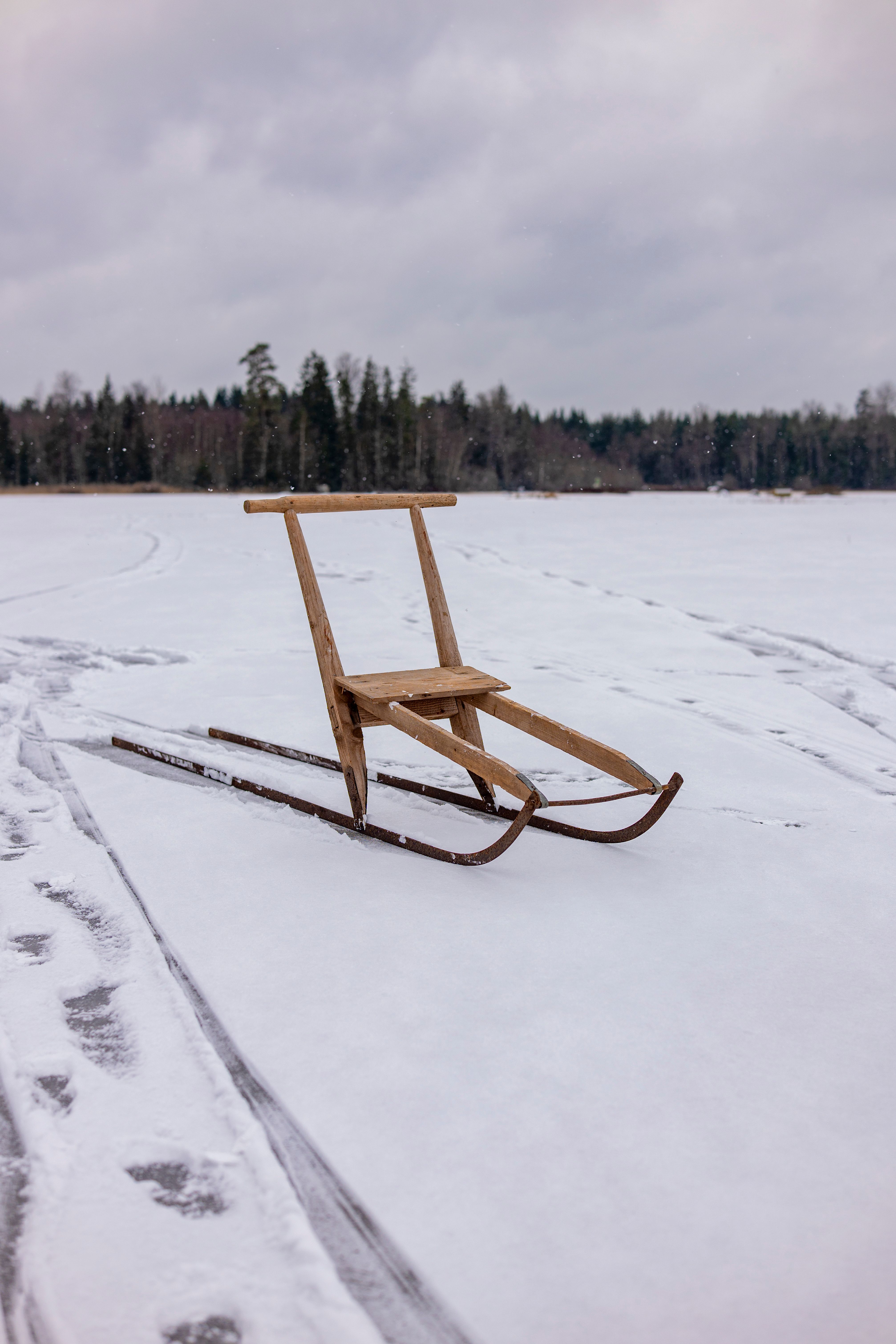 Traditional Wooden Sled on Snowy Lake · Free Stock Photo