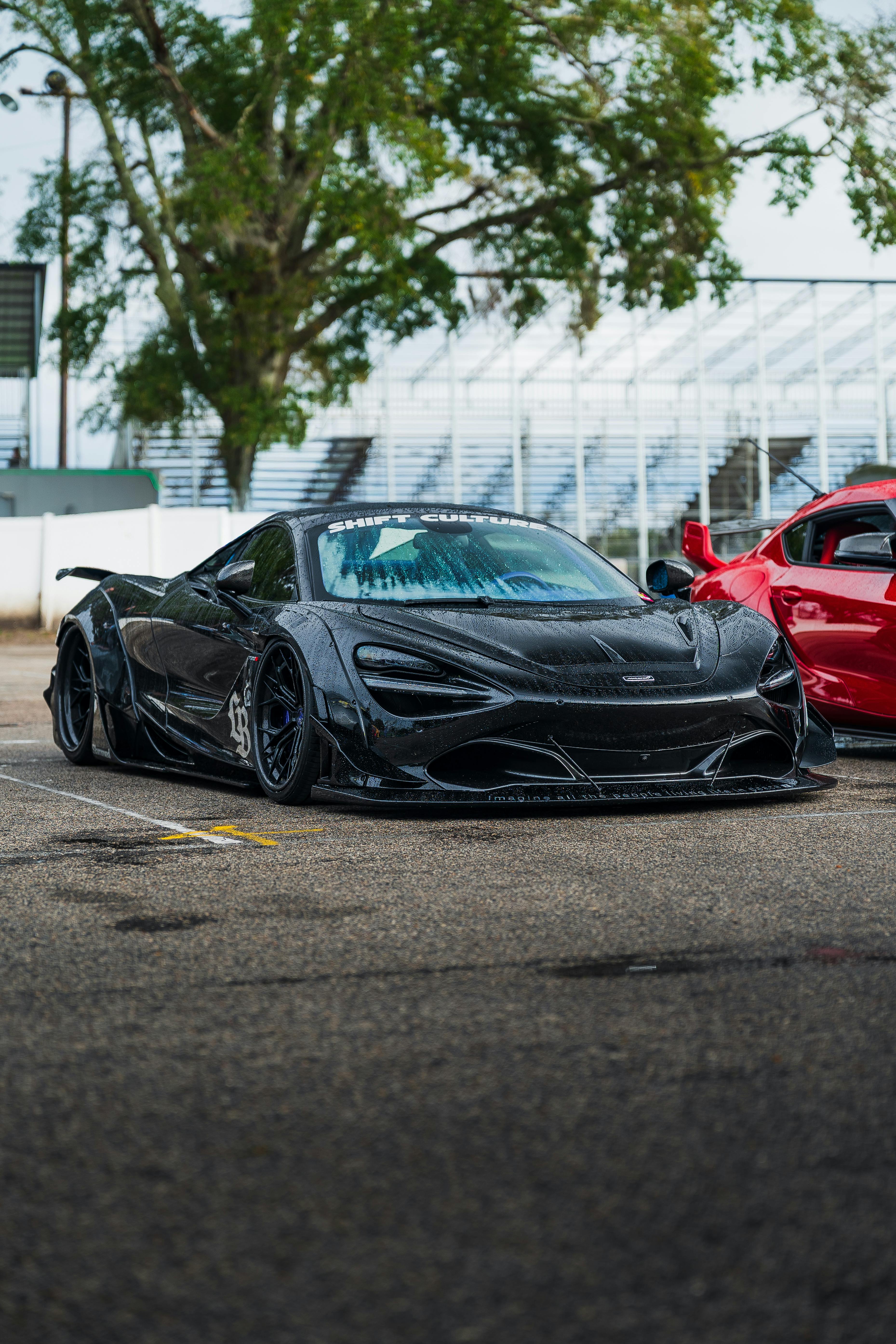Sleek Black Sports Car Parked Outdoors · Free Stock Photo