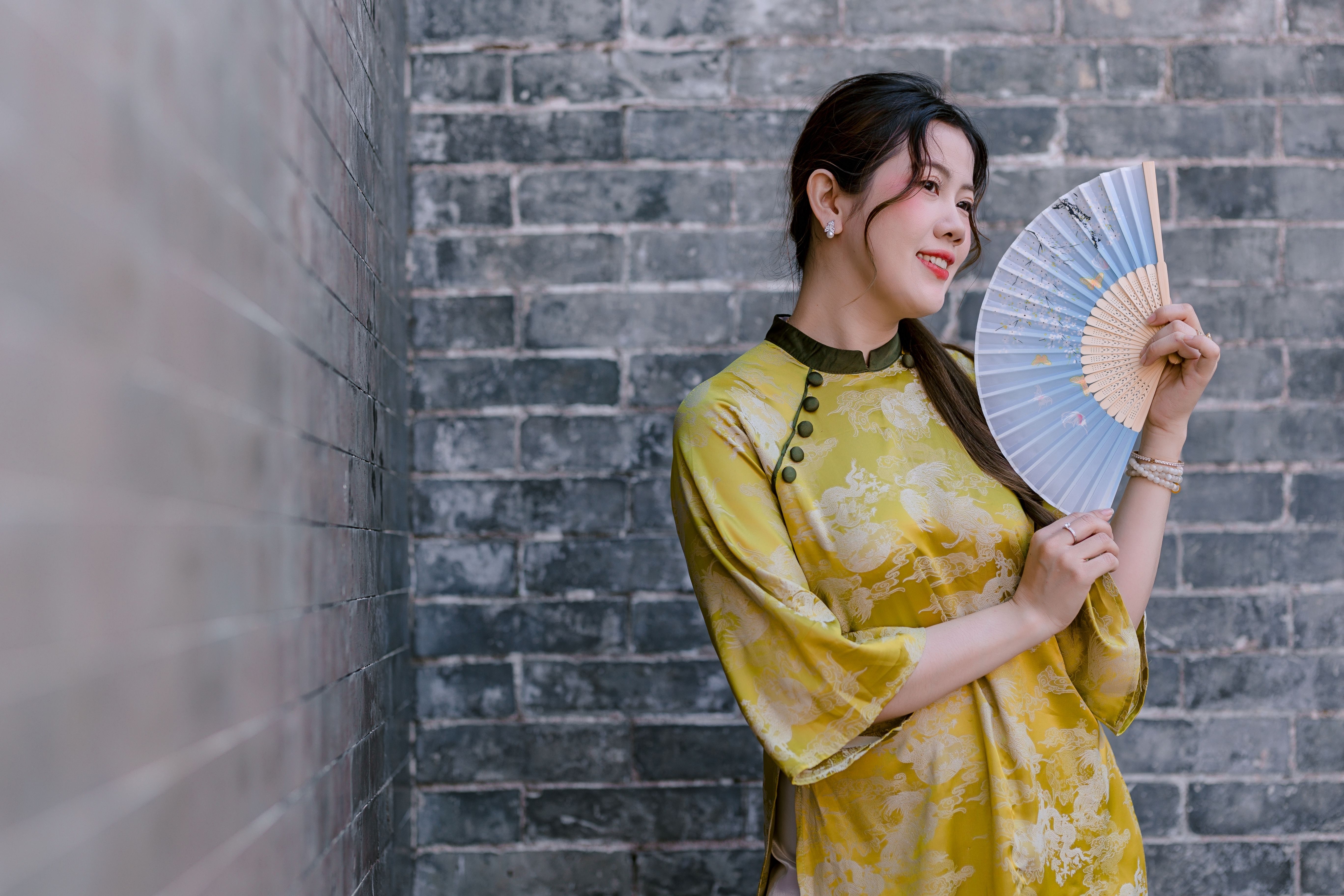 A Person Holding an Asian Fan · Free Stock Photo