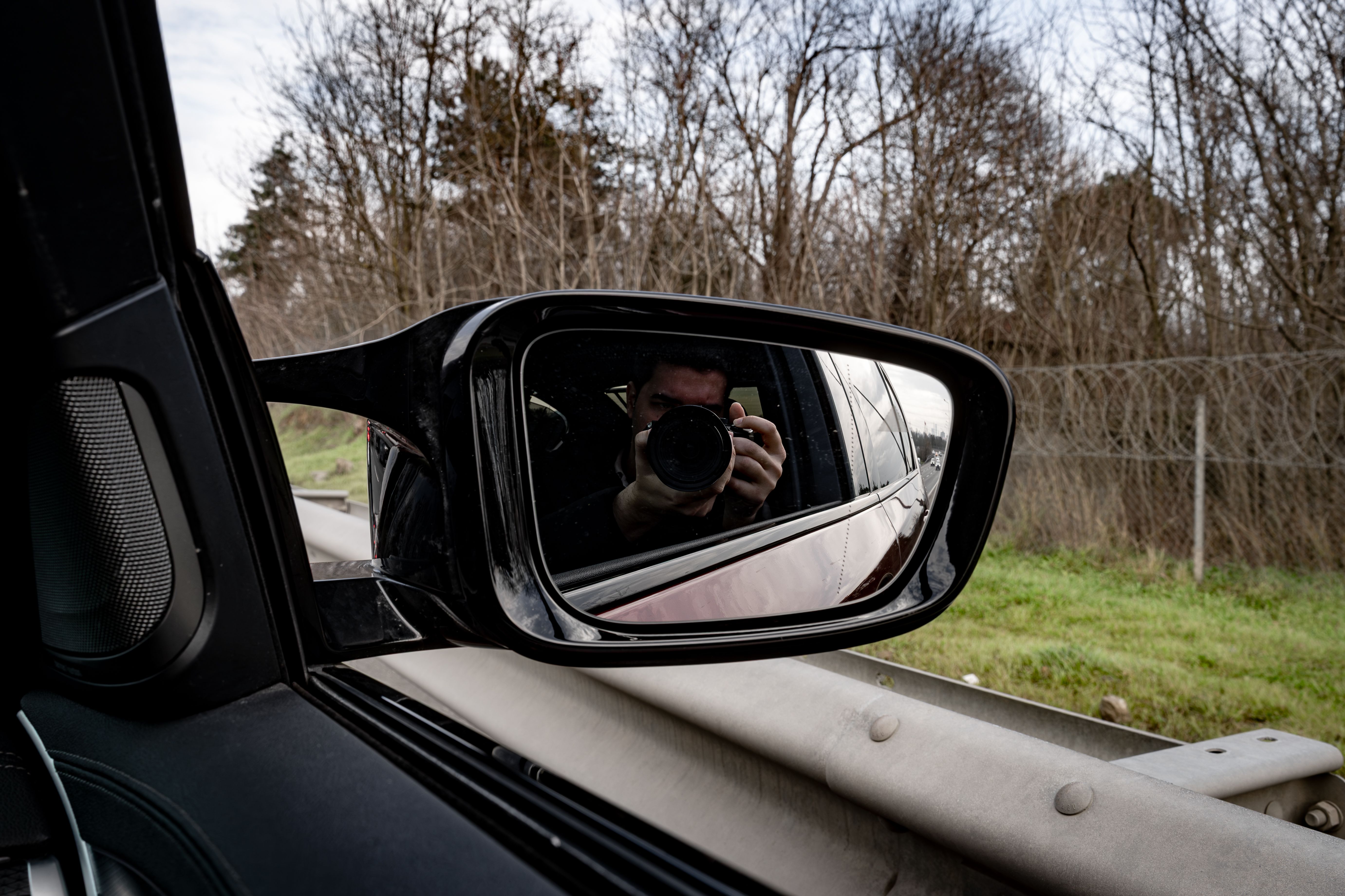 Reflection of Photographer in Car Side Mirror · Free Stock Photo