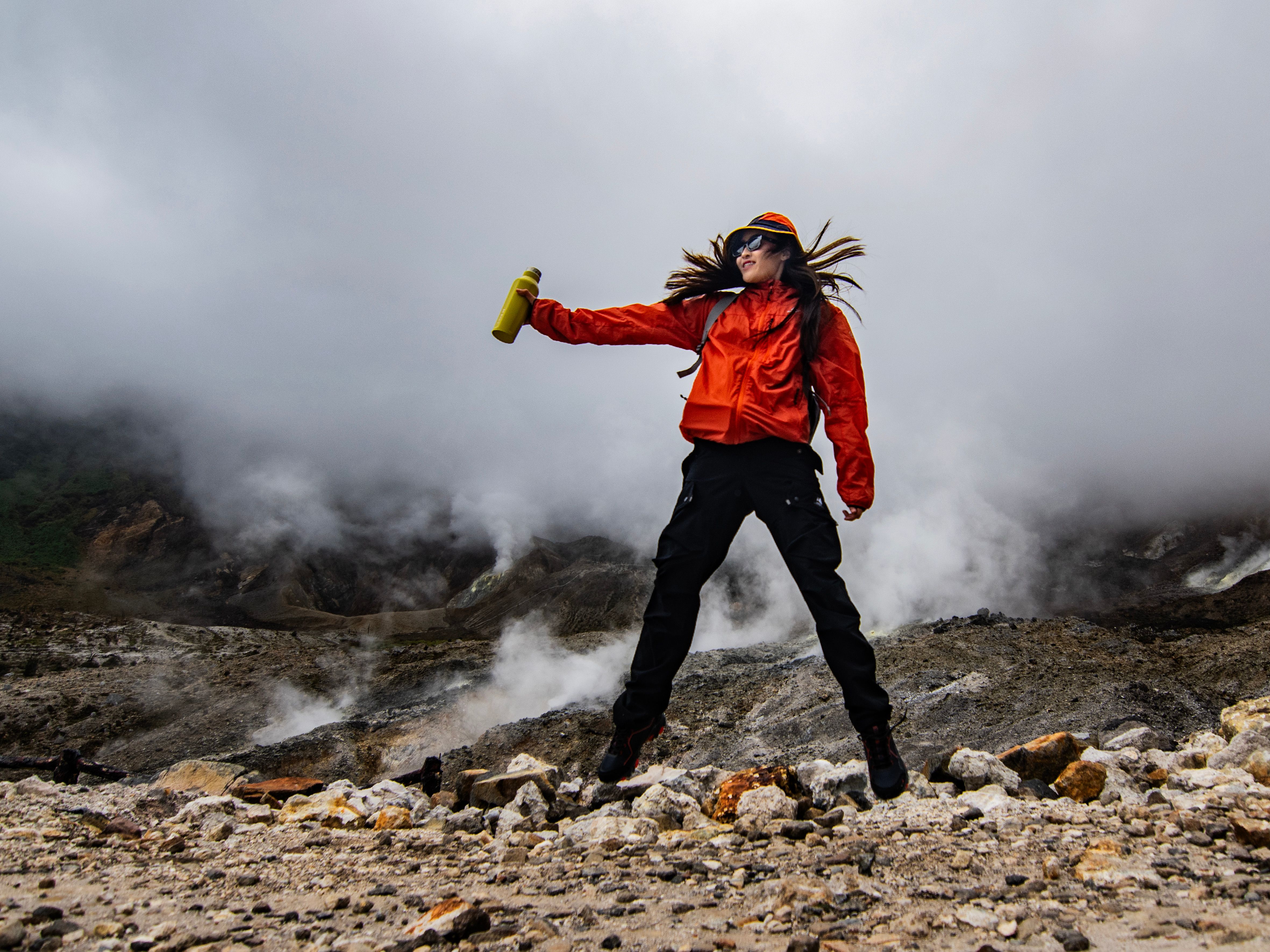 Adventurous Hiker on Cloudy Mountain Landscape · Free Stock Photo