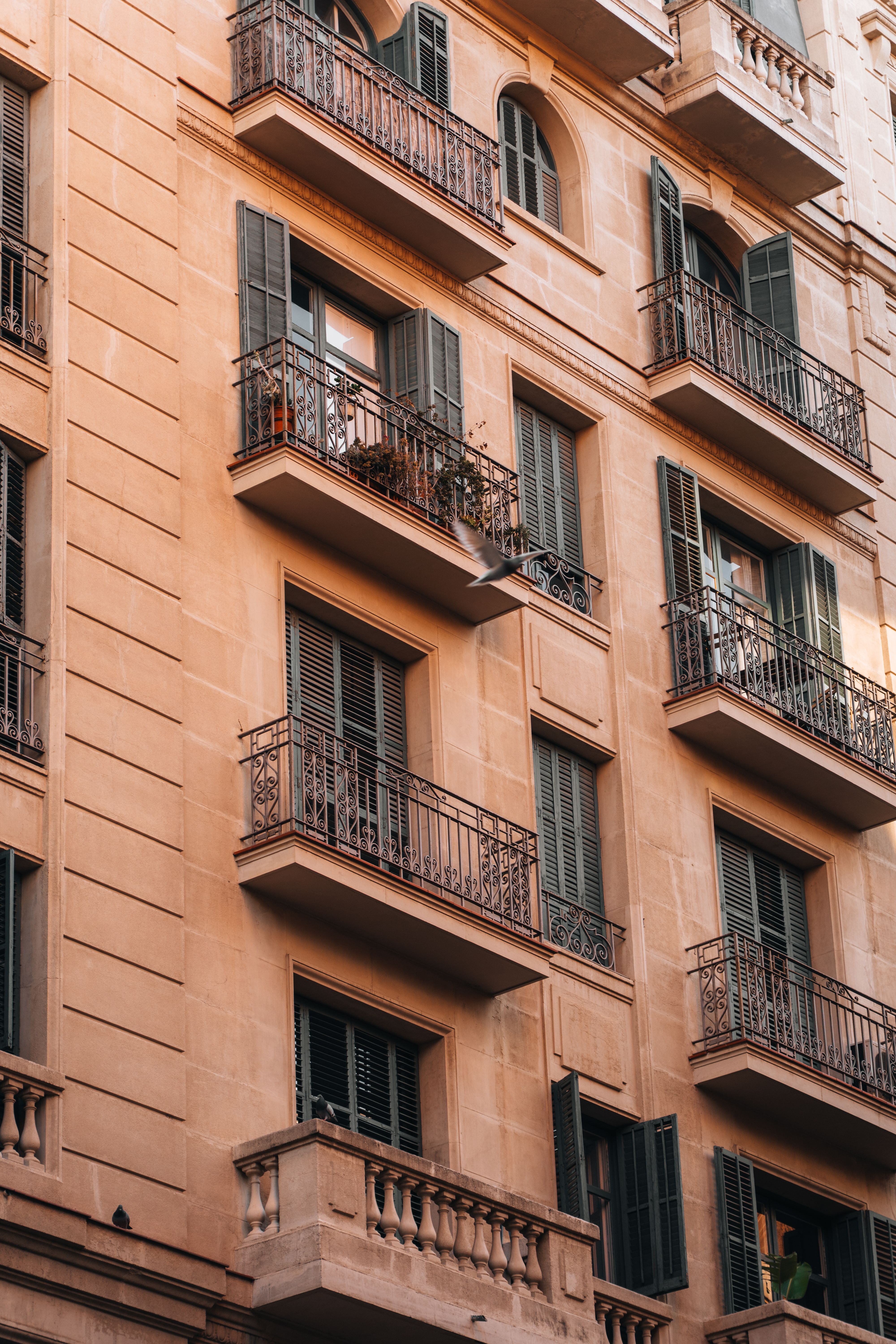 Elegant Urban Building Facade with Balconies · Free Stock Photo