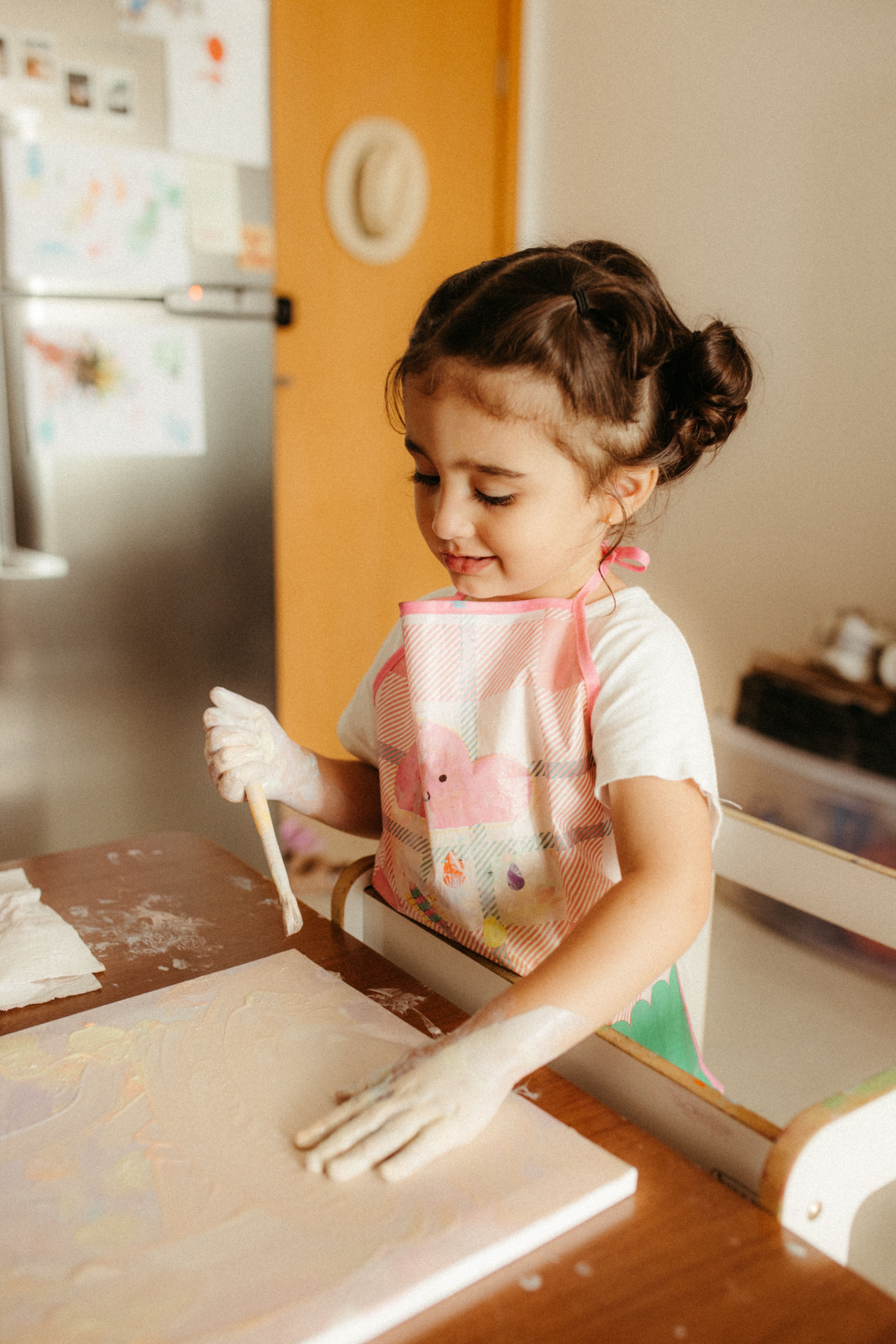 Young Child Painting with Enthusiasm Indoors · Free Stock Photo