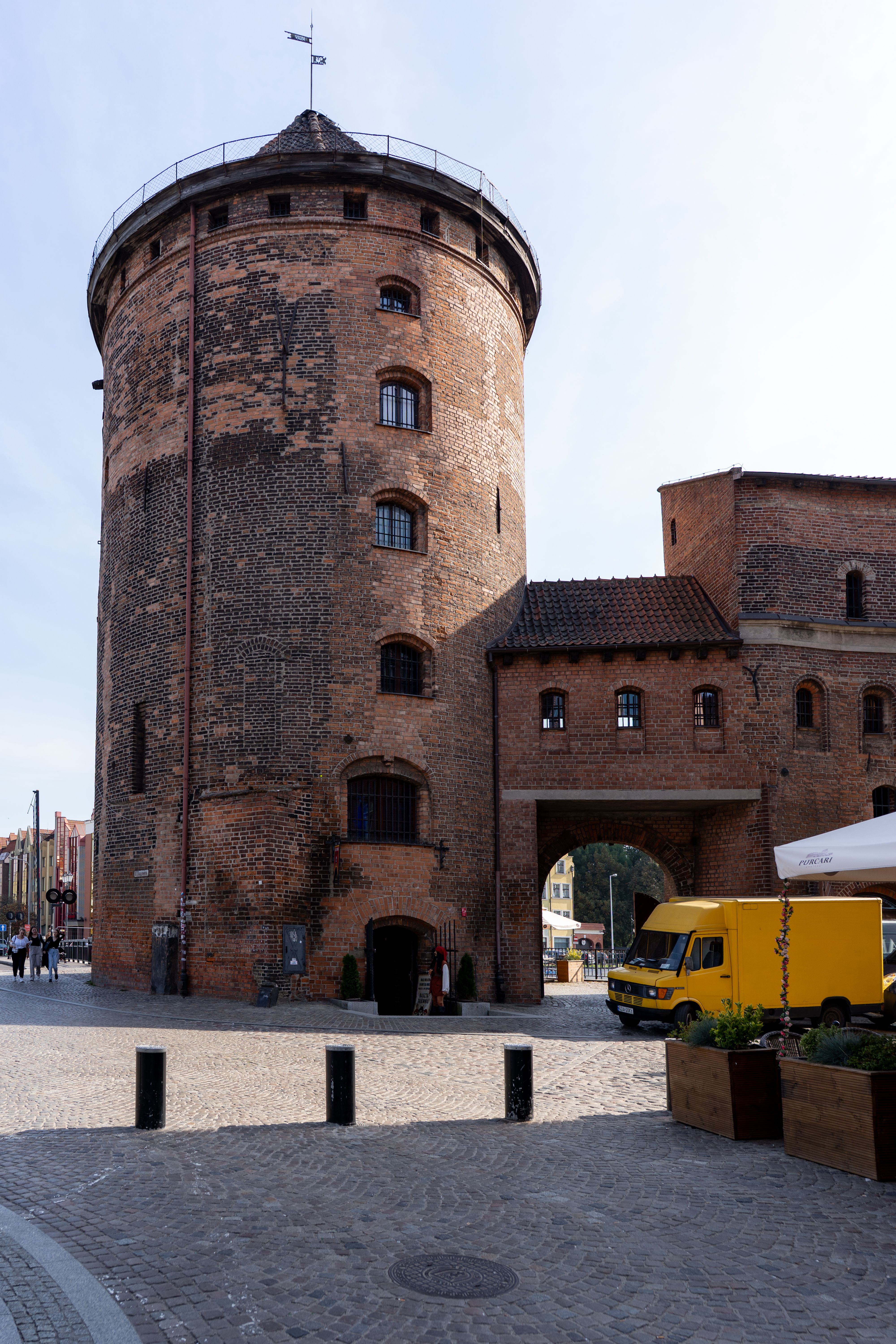 Medieval Brick Tower and Archway in Urban Setting · Free Stock Photo