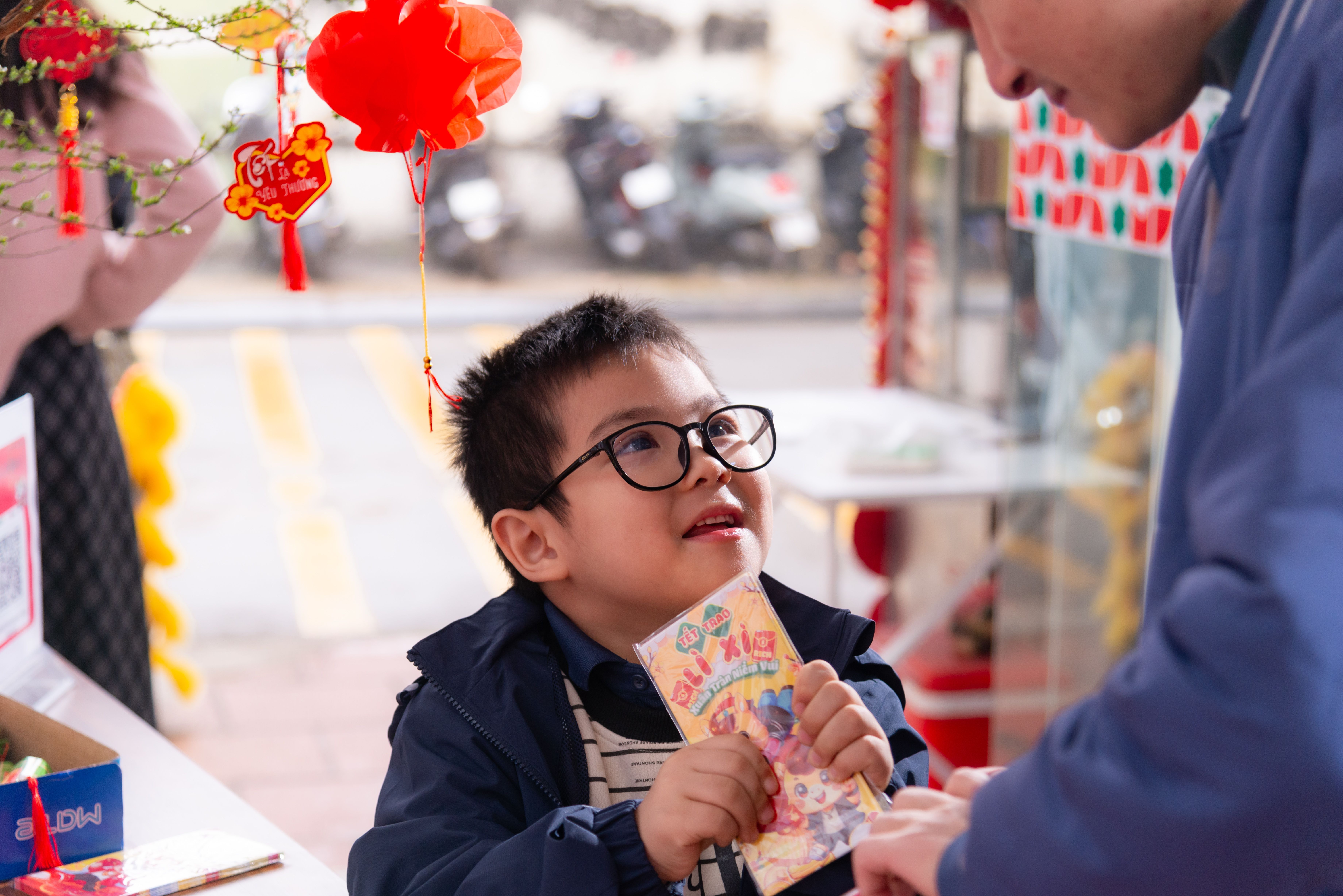 Child Receiving Lucky Money During Lunar New Year · Free Stock Photo
