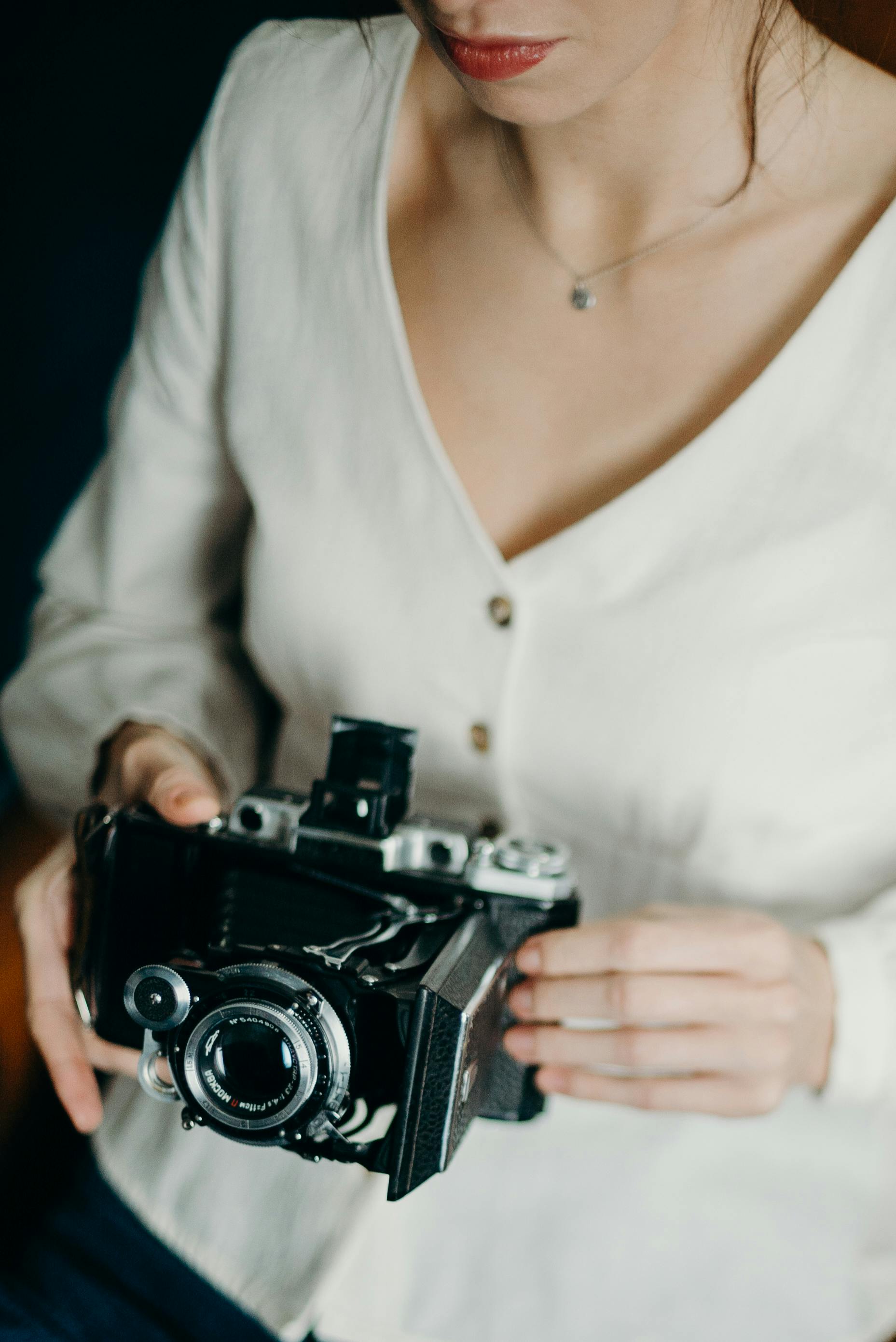 Woman Holding Camera · Free Stock Photo