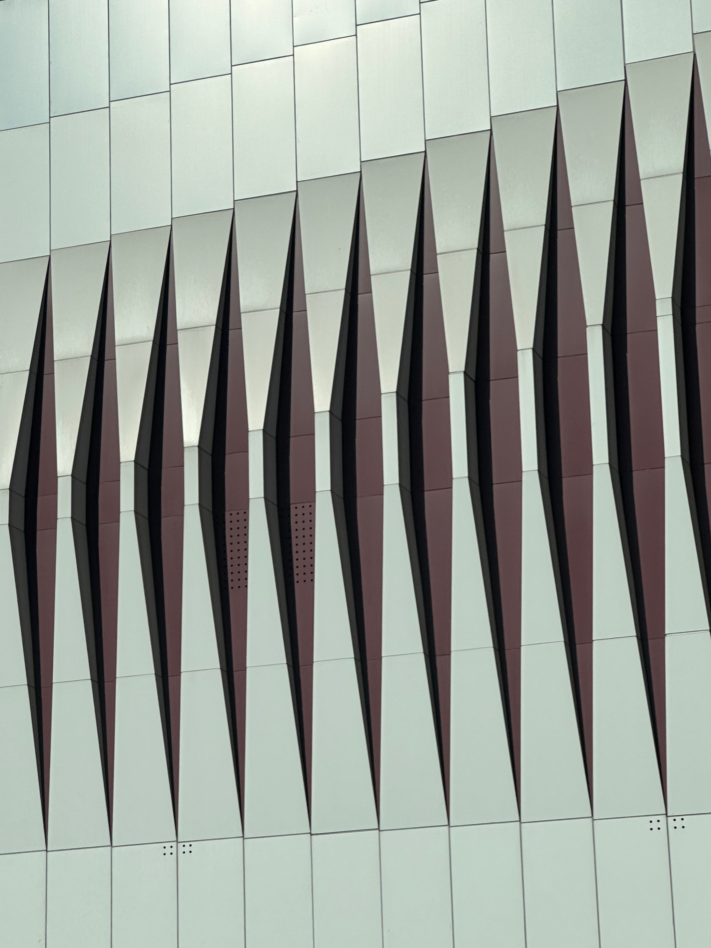 Modern Architectural Façade with Geometric Shapes · Free Stock Photo