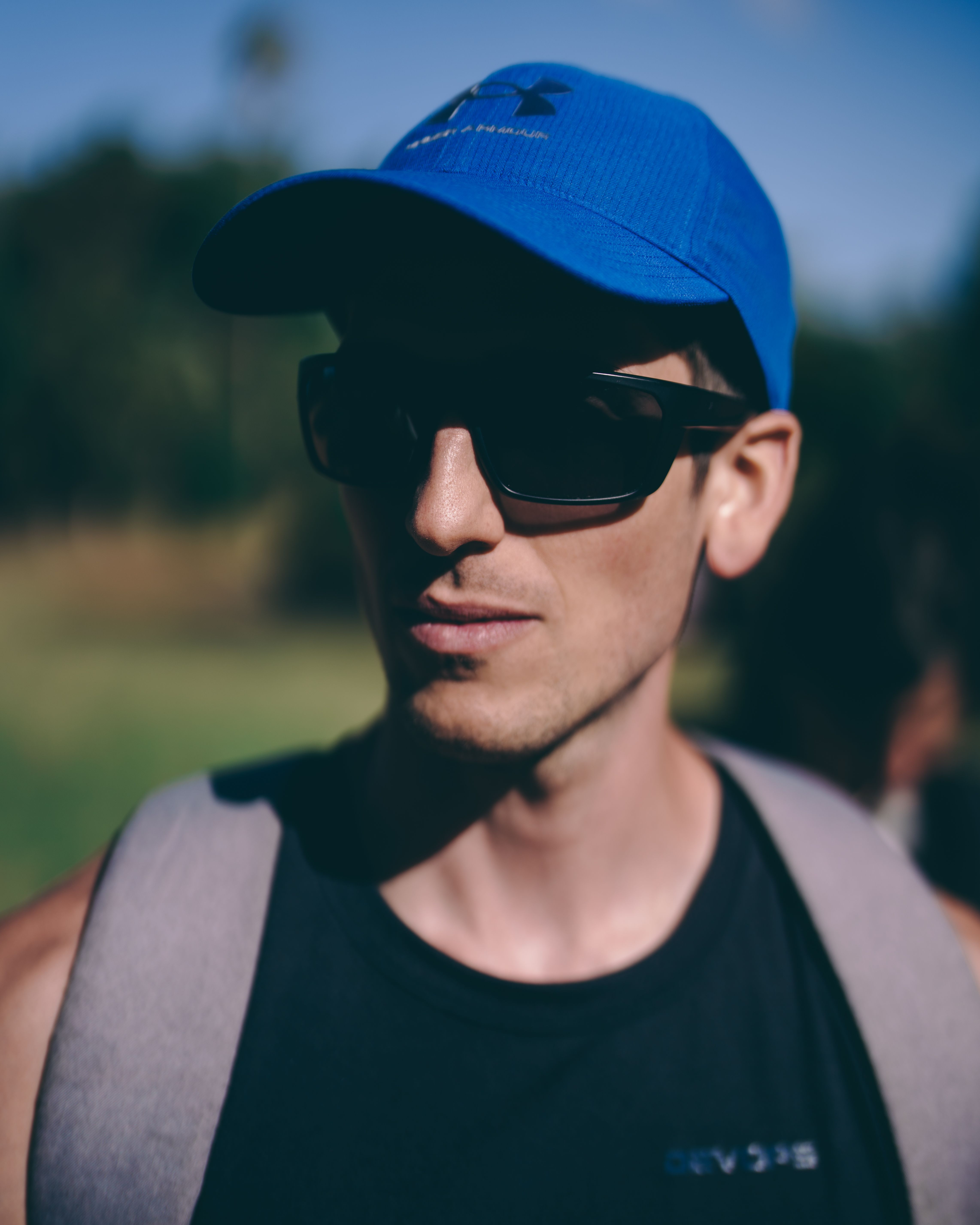 Man with Blue Cap in Outdoor Setting · Free Stock Photo