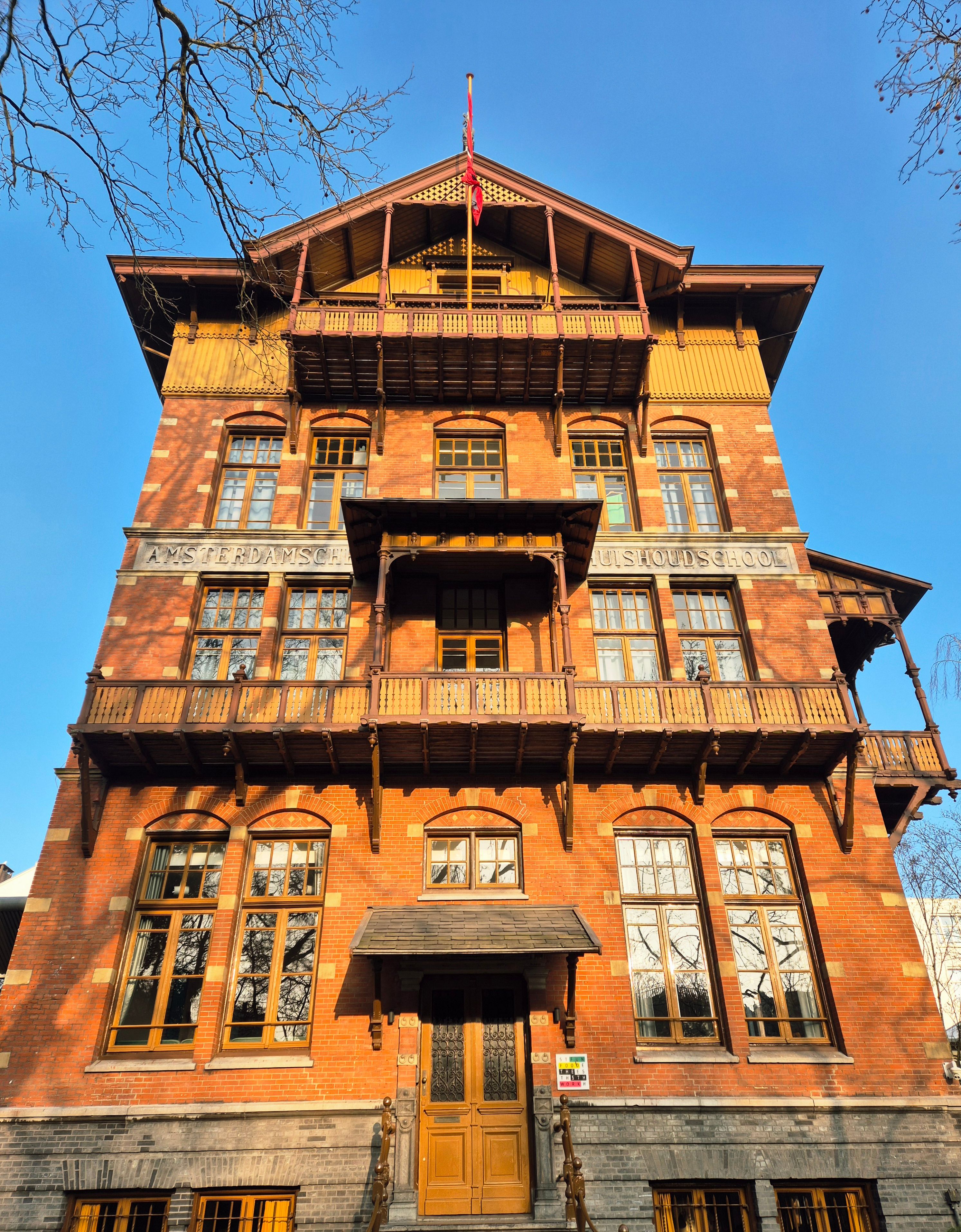 Historic Brick Building under Clear Blue Sky · Free Stock Photo