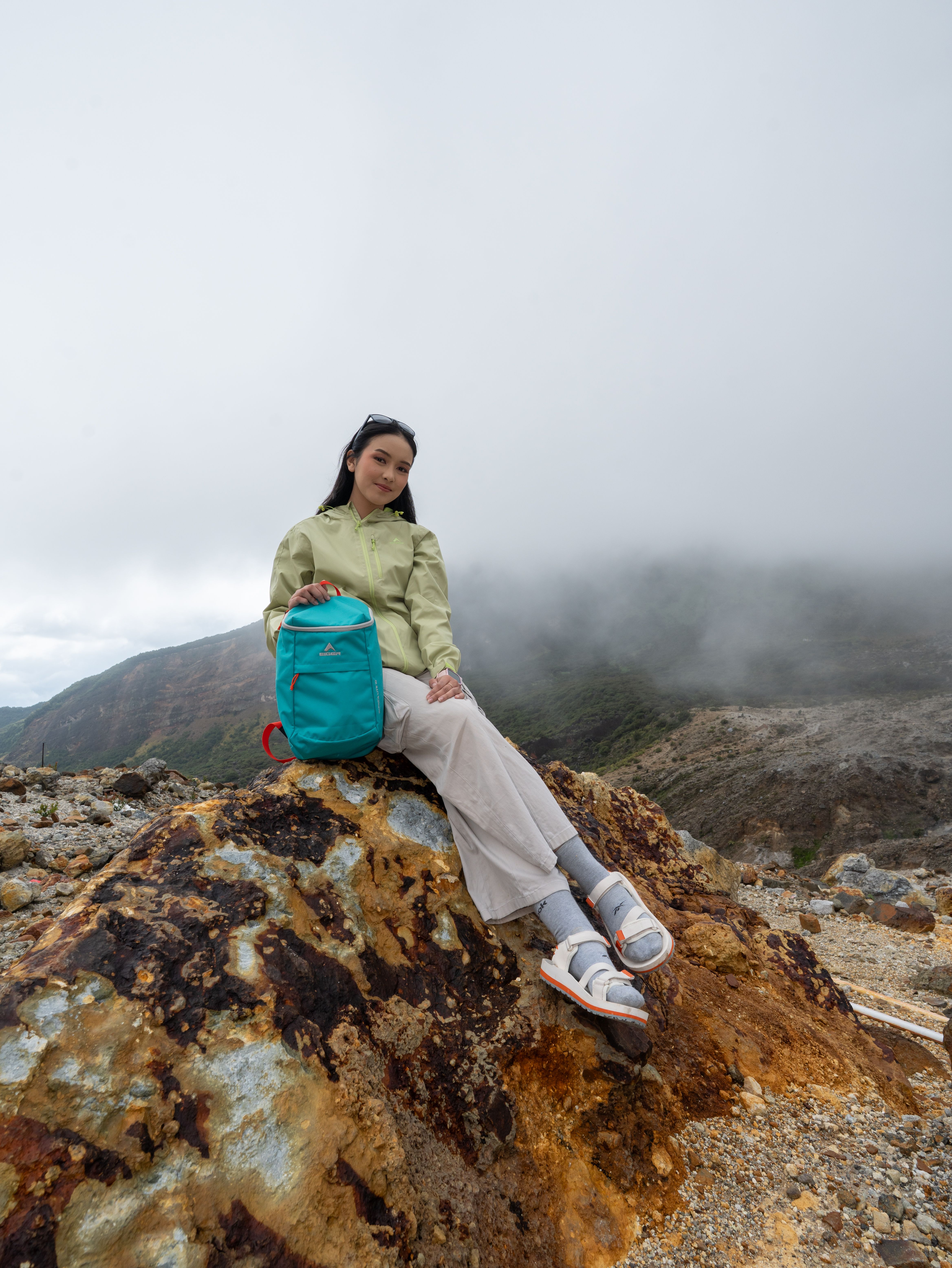 Young Woman Relaxing on Volcanic Rock in West Java · Free Stock Photo
