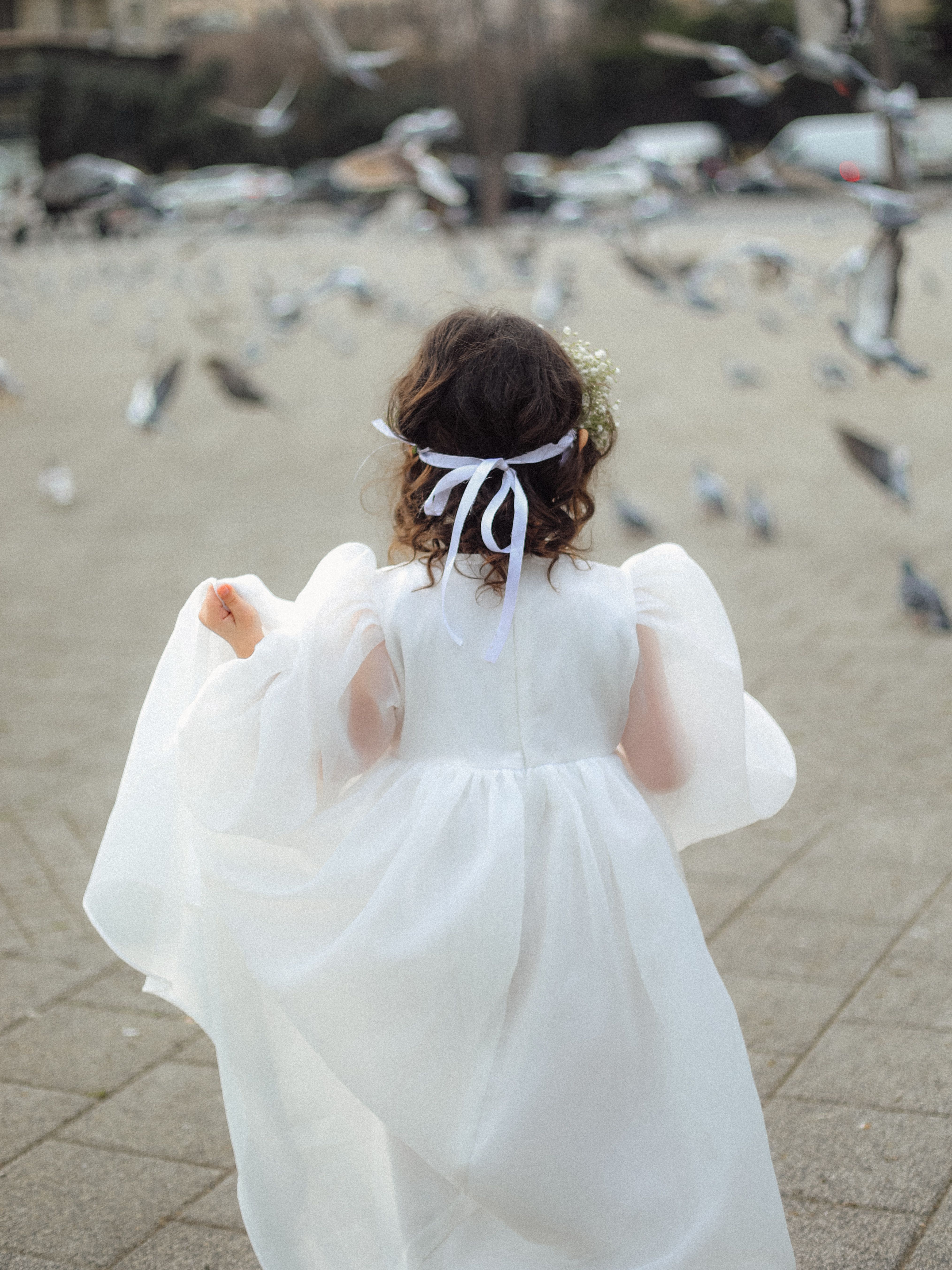 Young Girl in White Dress with Flying Birds · Free Stock Photo