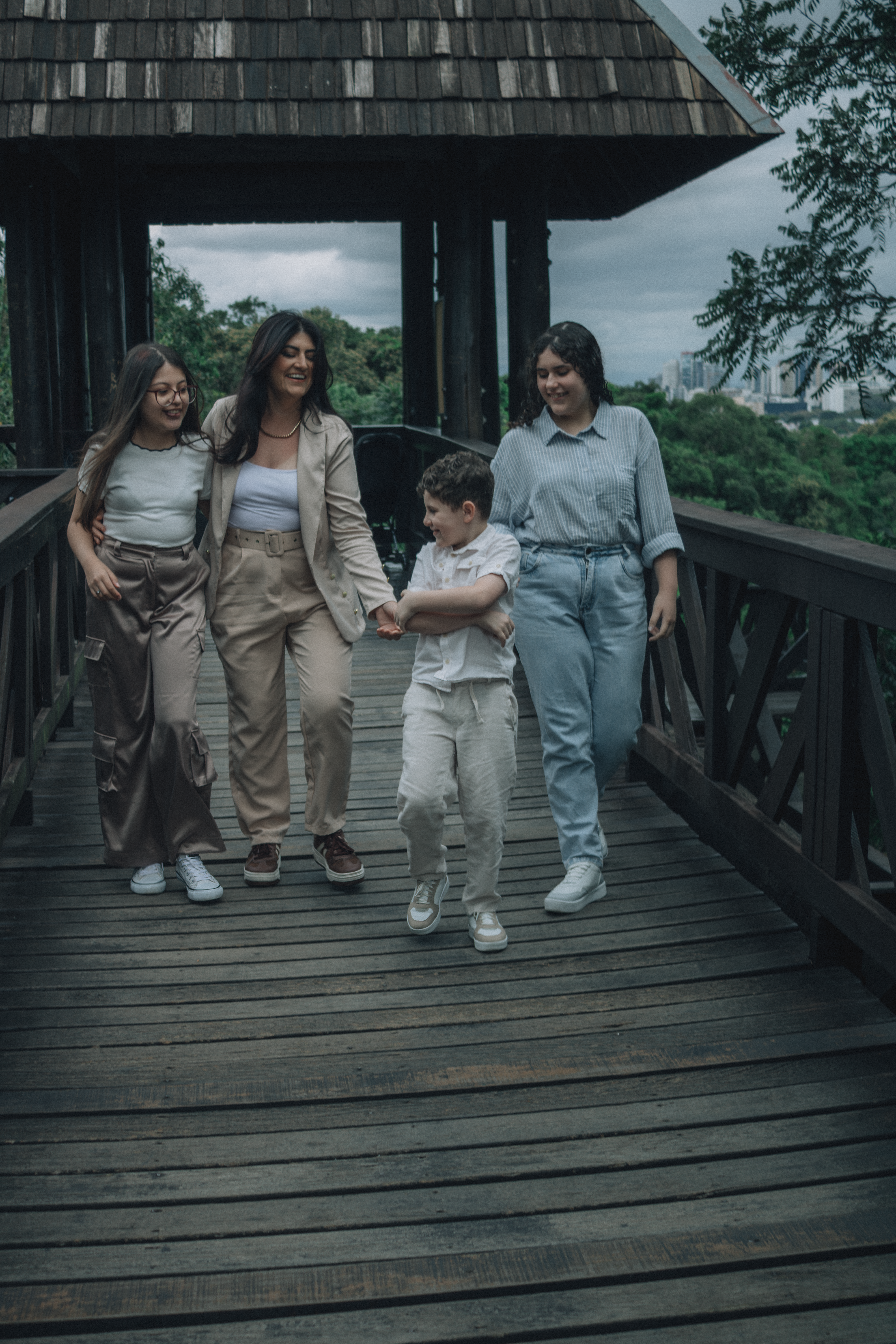 Family Stroll on Scenic Wooden Bridge Outdoors · Free Stock Photo
