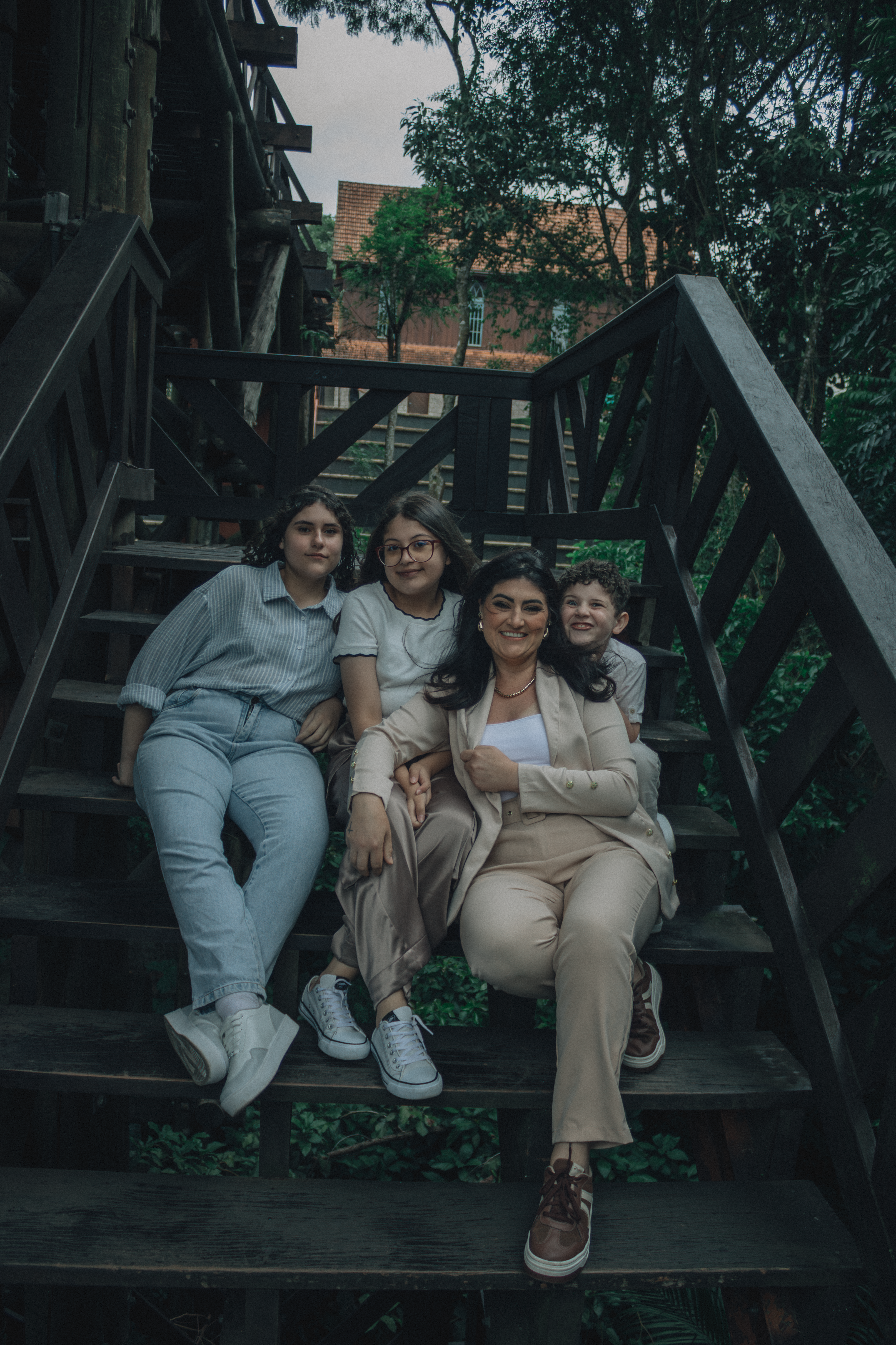 Family Portrait on Rustic Wooden Stairs Outdoors · Free Stock Photo