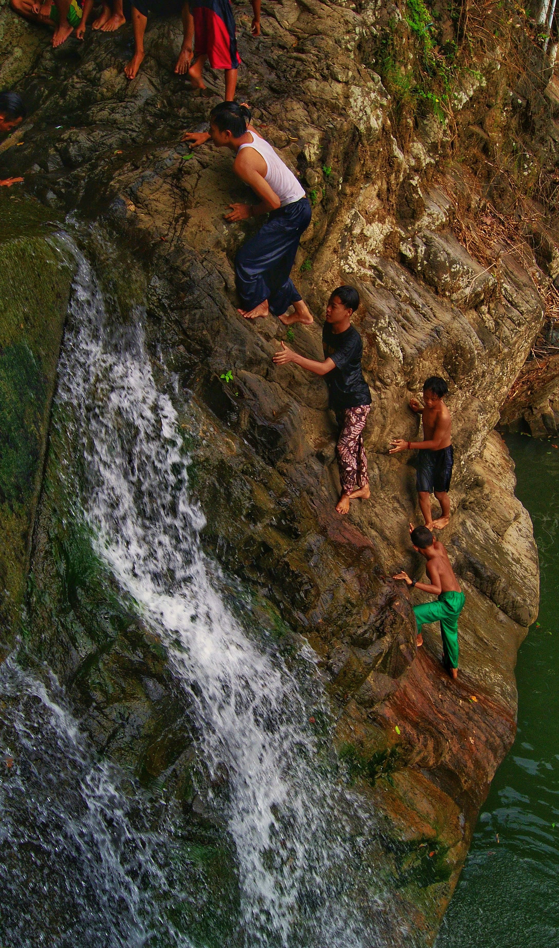 Children Climbing Waterfall Rocks in Indonesia · Free Stock Photo