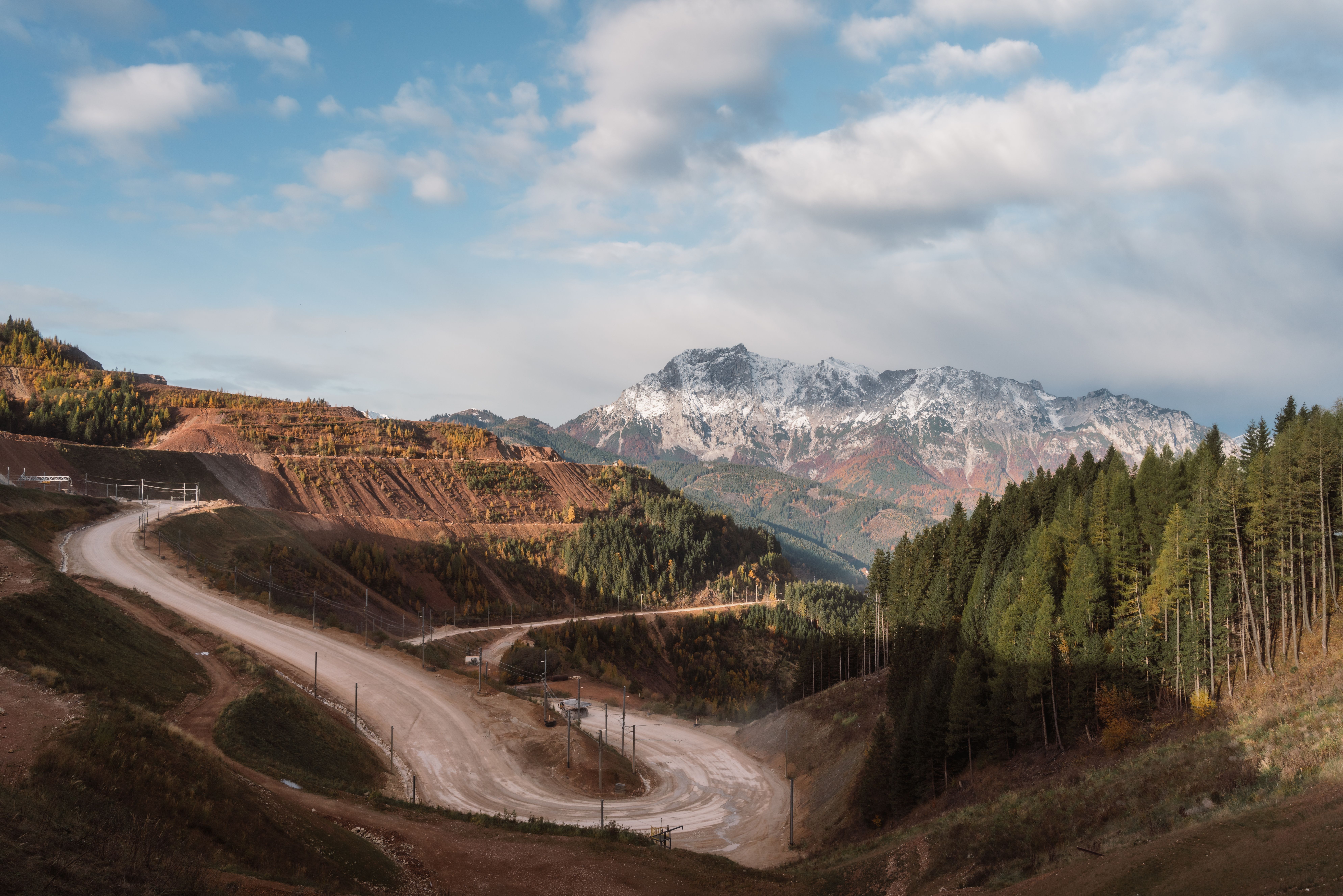 Majestic Mountain Road in Serene Alpine Landscape · Free Stock Photo