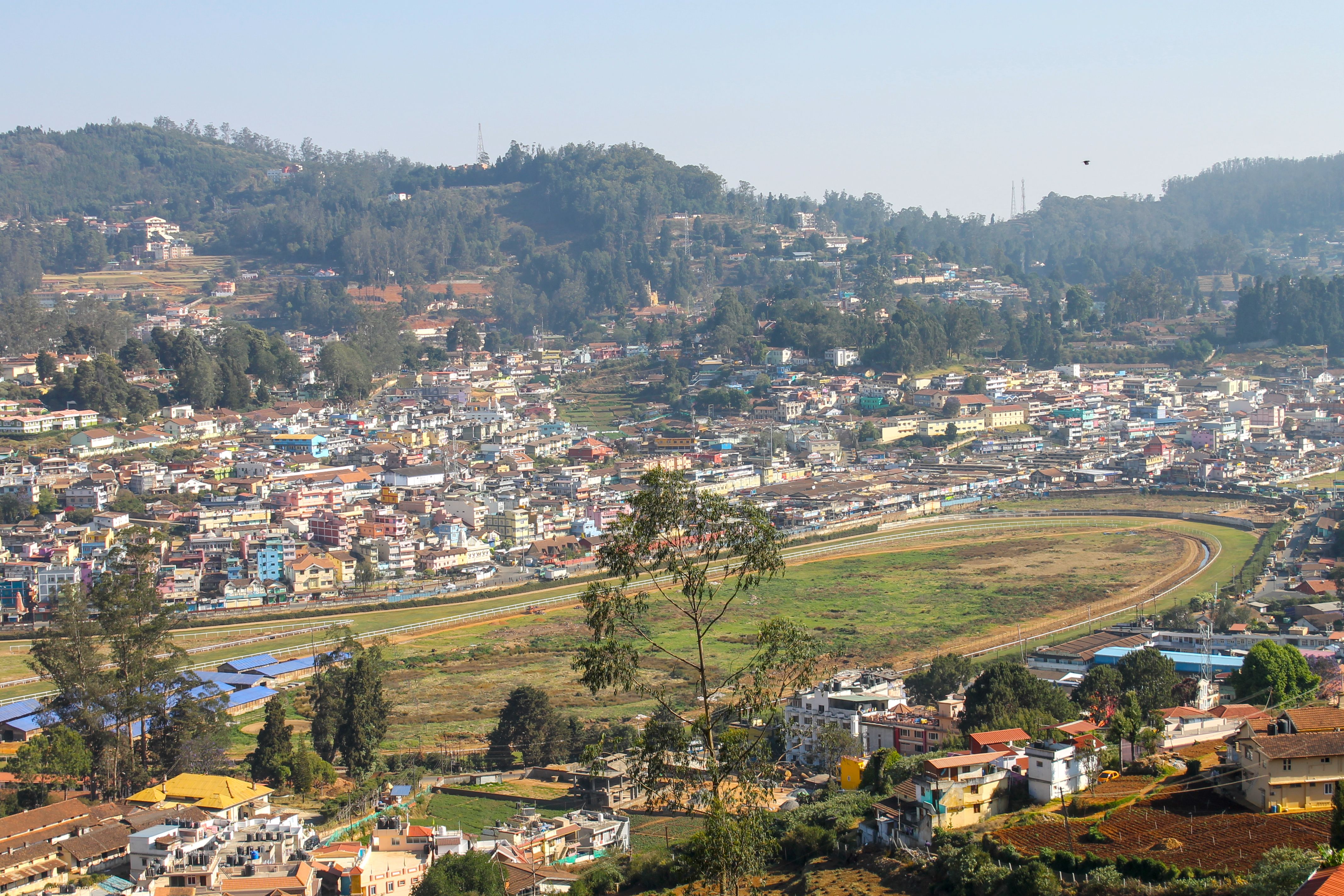 Scenic Aerial View of City in Mountainous Landscape · Free Stock Photo