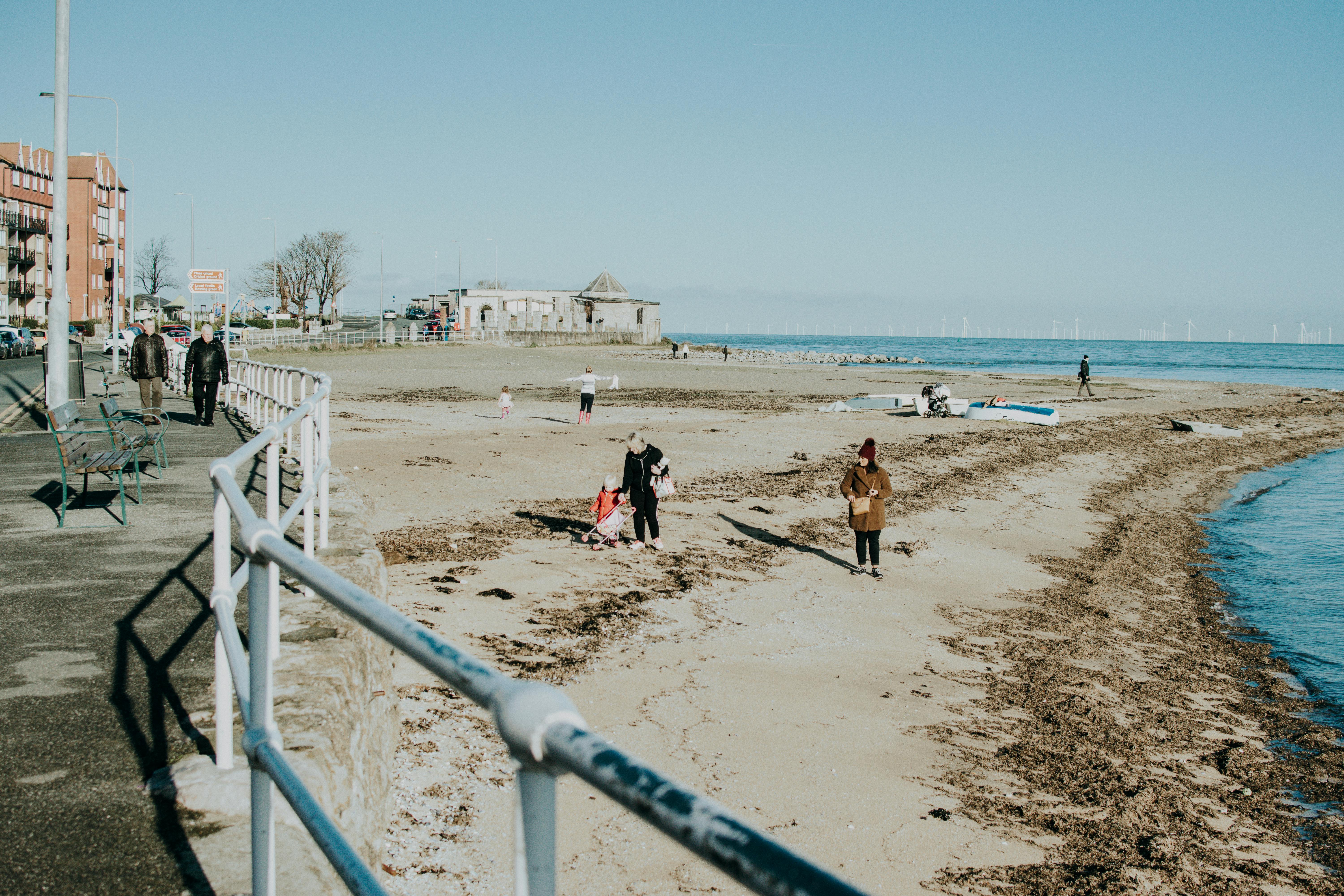 People Walking Near Beach Line · Free Stock Photo