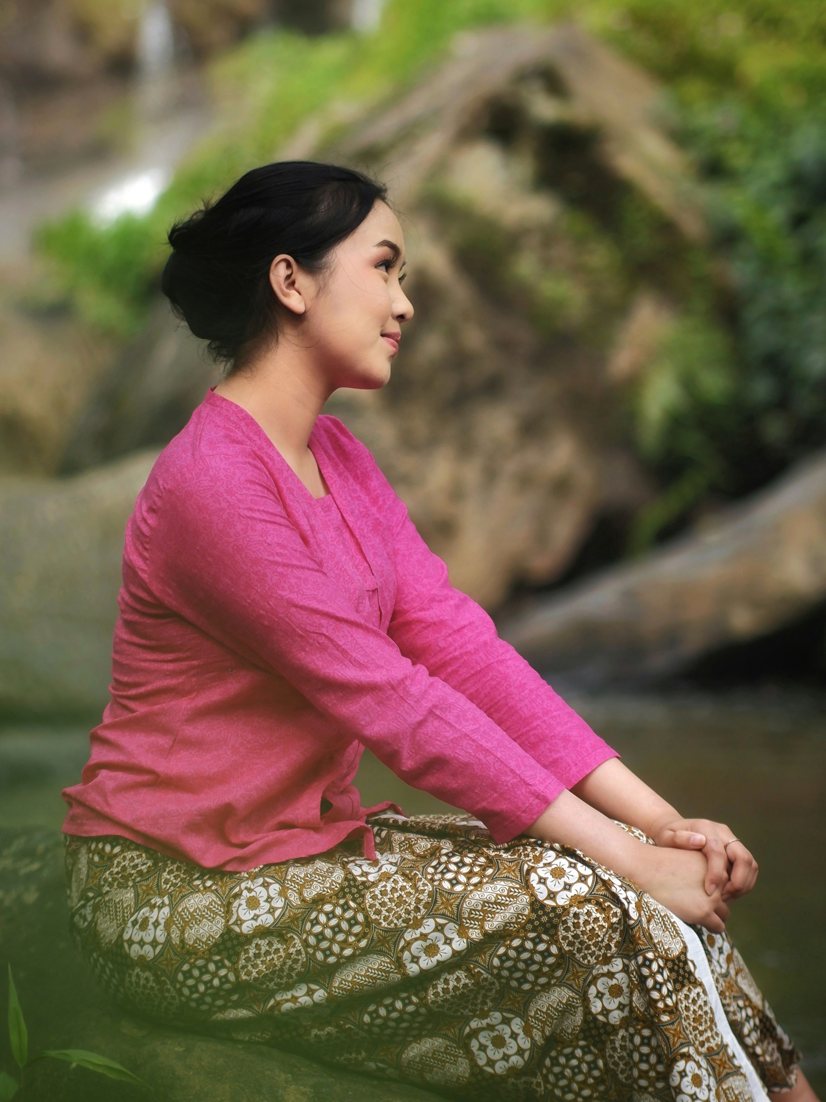 Woman in Traditional Attire by Waterfall · Free Stock Photo