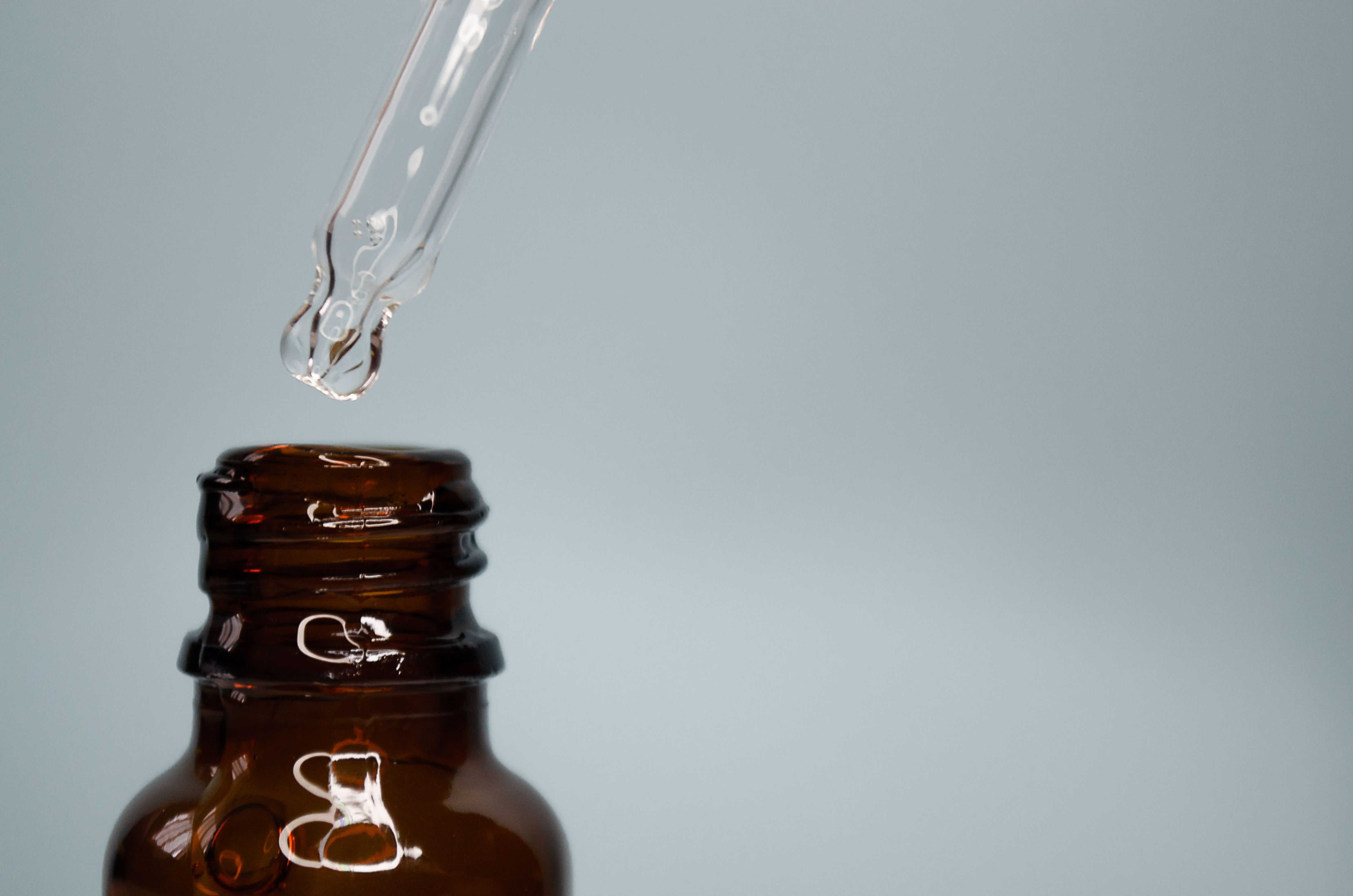 Close-up of Dropper with Amber Bottle · Free Stock Photo