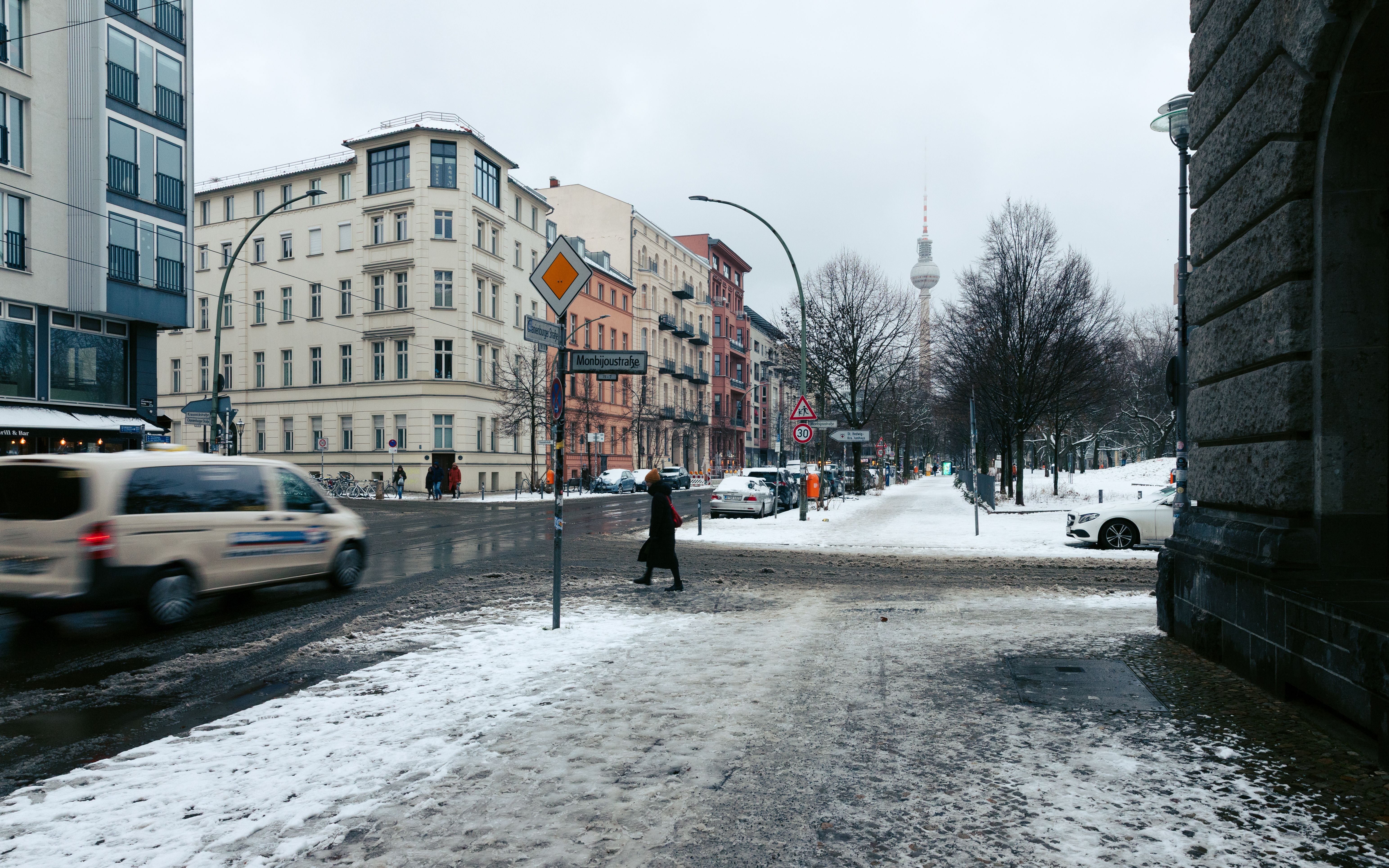 Snowy Berlin Street with TV Tower in Winter · Free Stock Photo