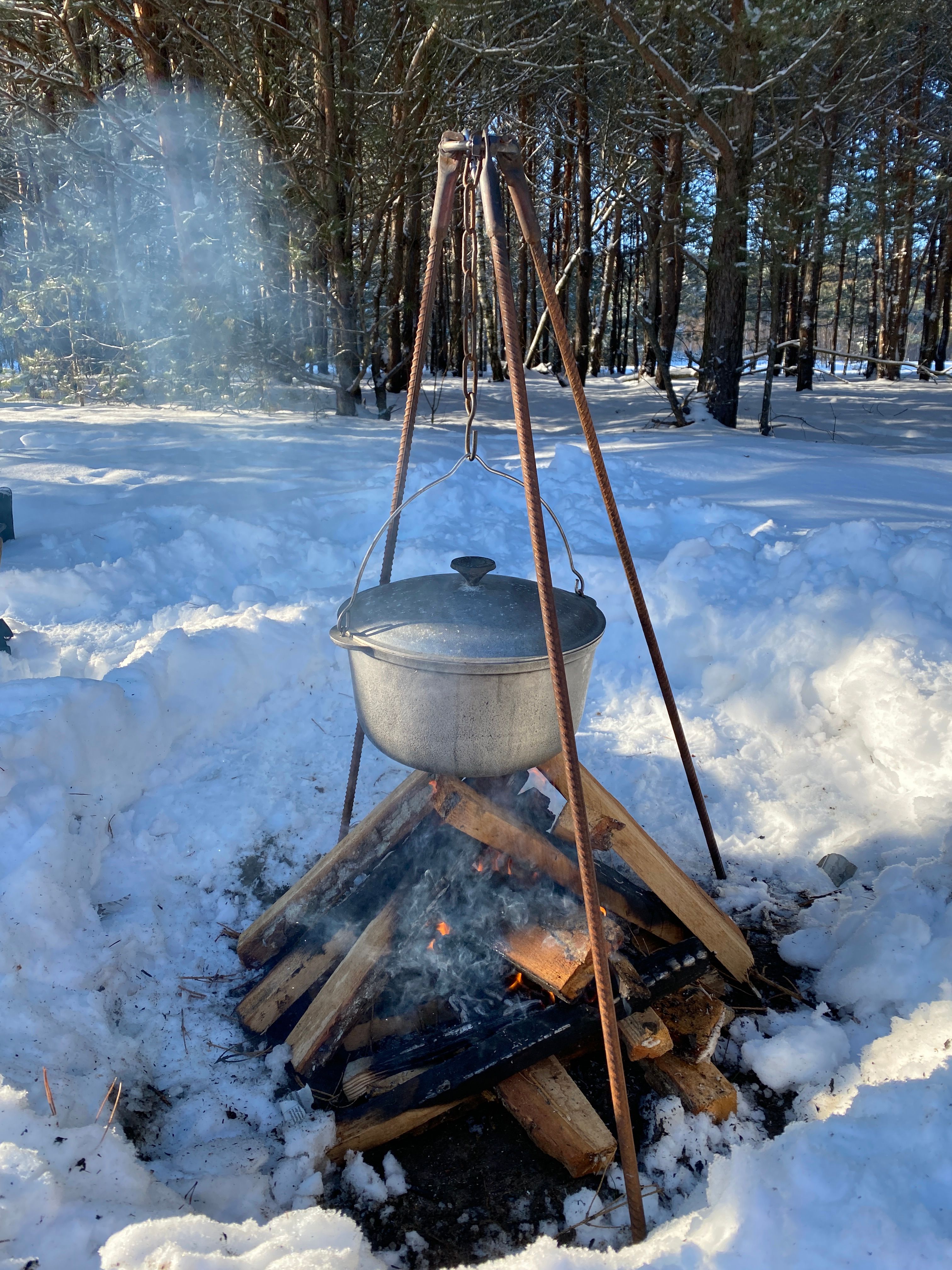 Outdoor Winter Cooking Over Open Fire in Snow · Free Stock Photo