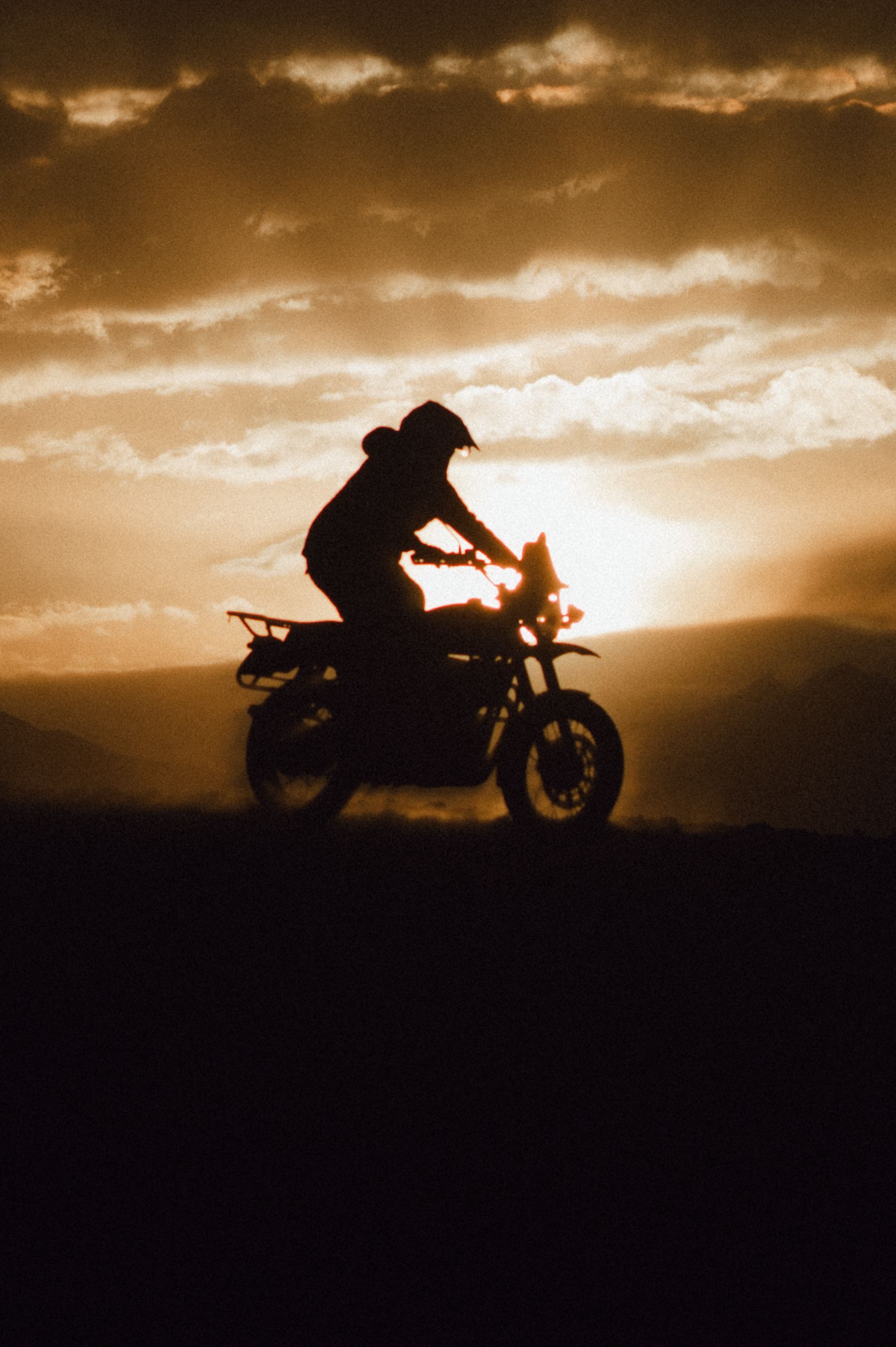 Silhouette of Motorcycle Rider at Sunset in Leh · Free Stock Photo