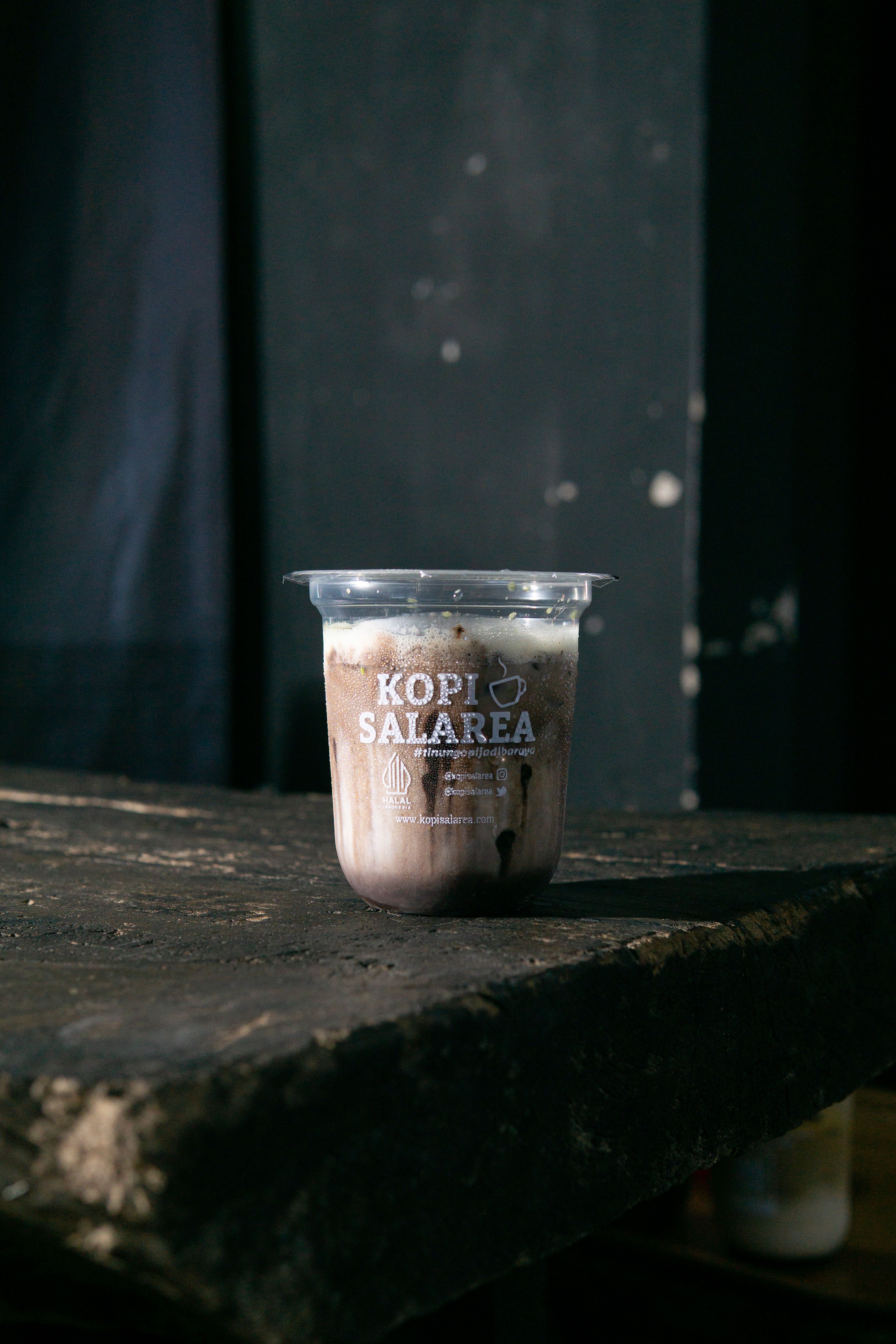 Kopi Salarea Iced Coffee on Rustic Table · Free Stock Photo