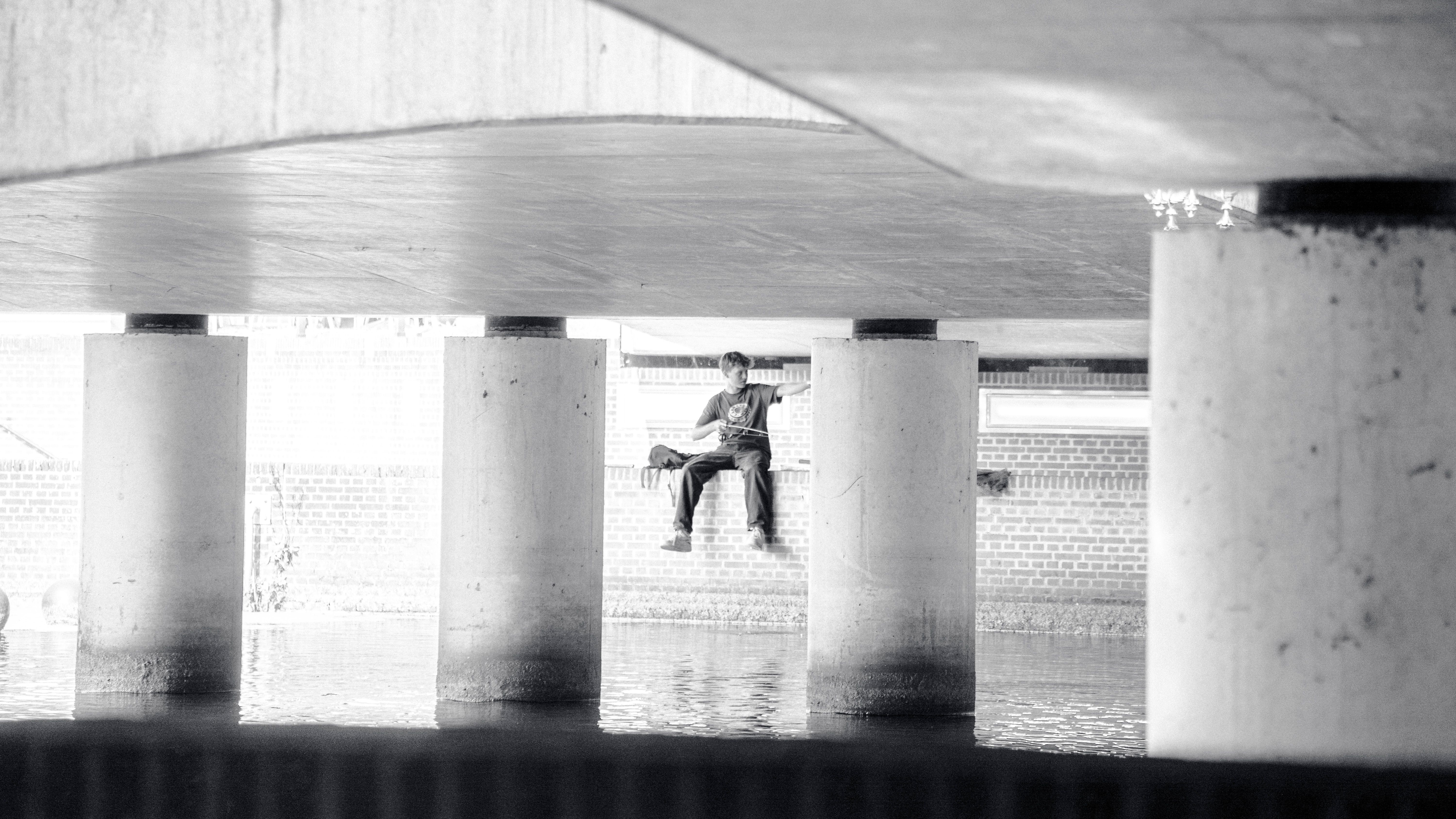 Person Relaxing Under Bridge in Amersfoort · Free Stock Photo