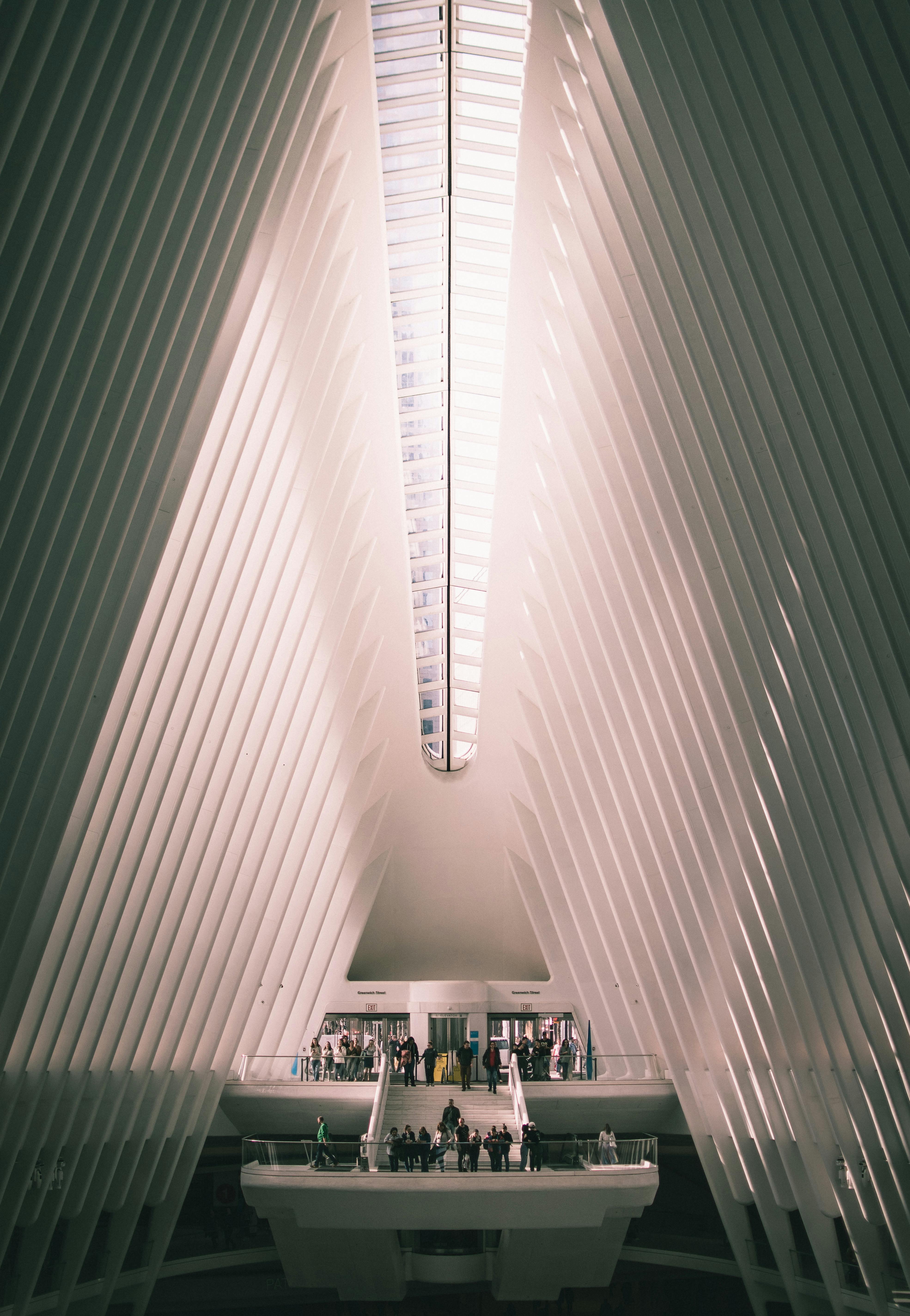 People Walking Inside Glass Building · Free Stock Photo