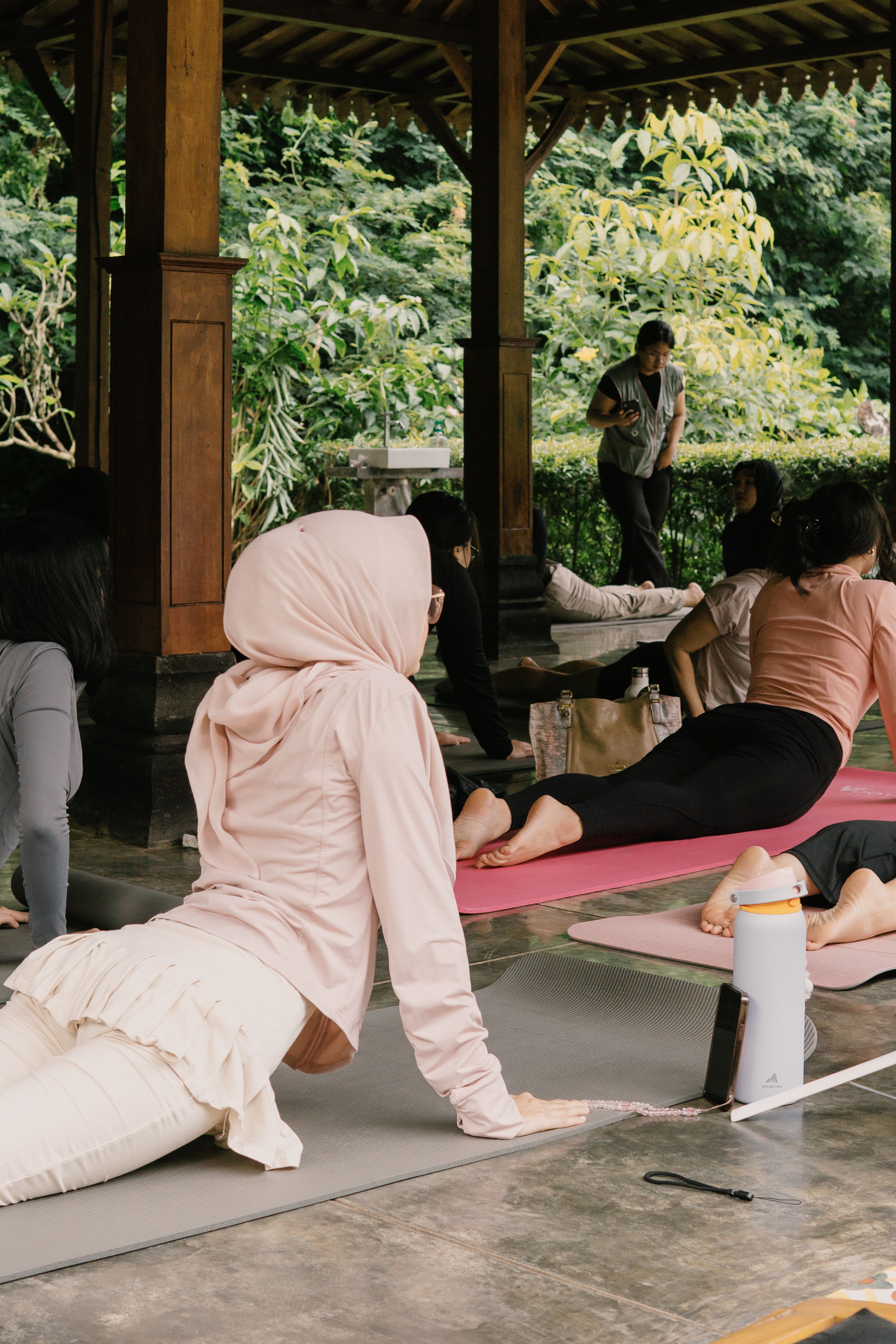 Outdoor Yoga Session in Indonesian Pavilion Setting · Free Stock Photo