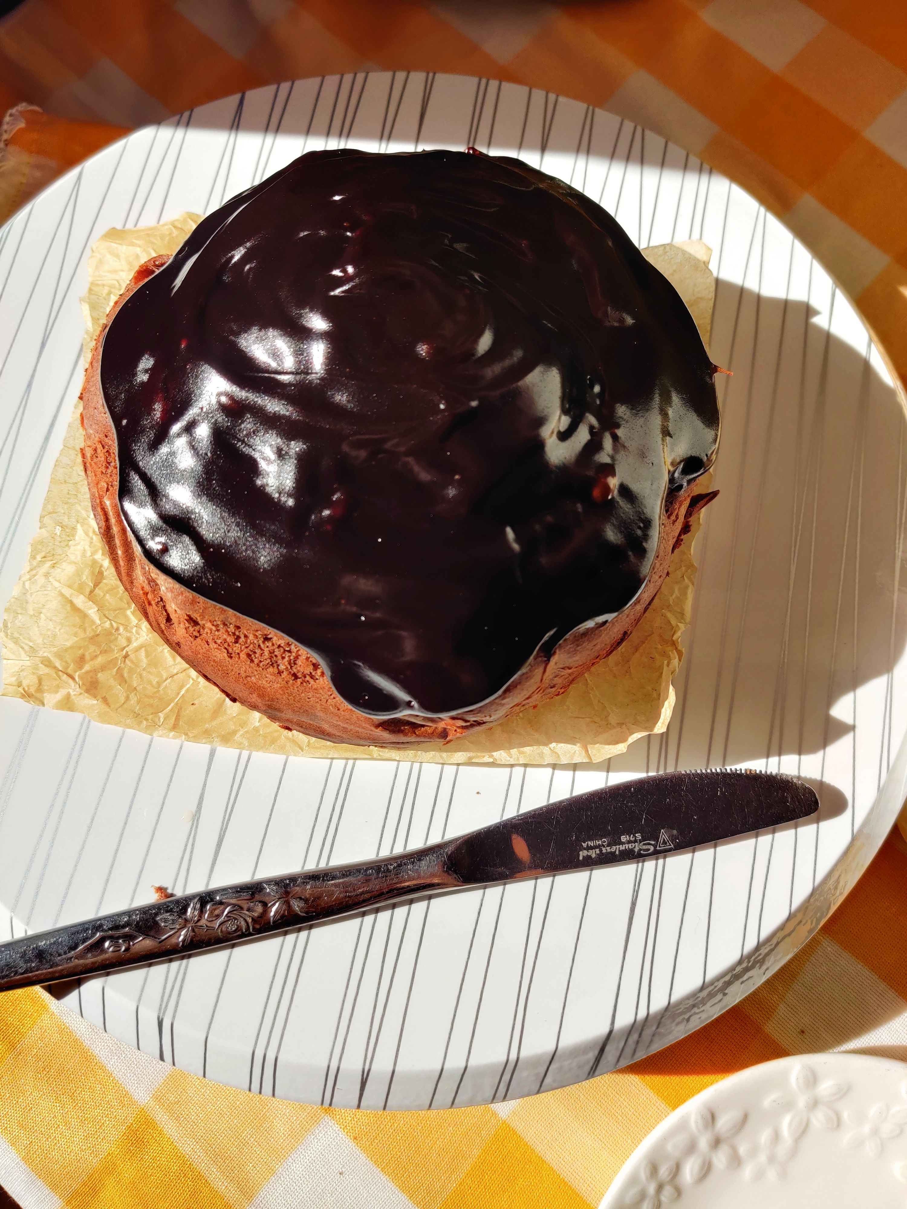 Rich Chocolate Ganache Cake on Table · Free Stock Photo