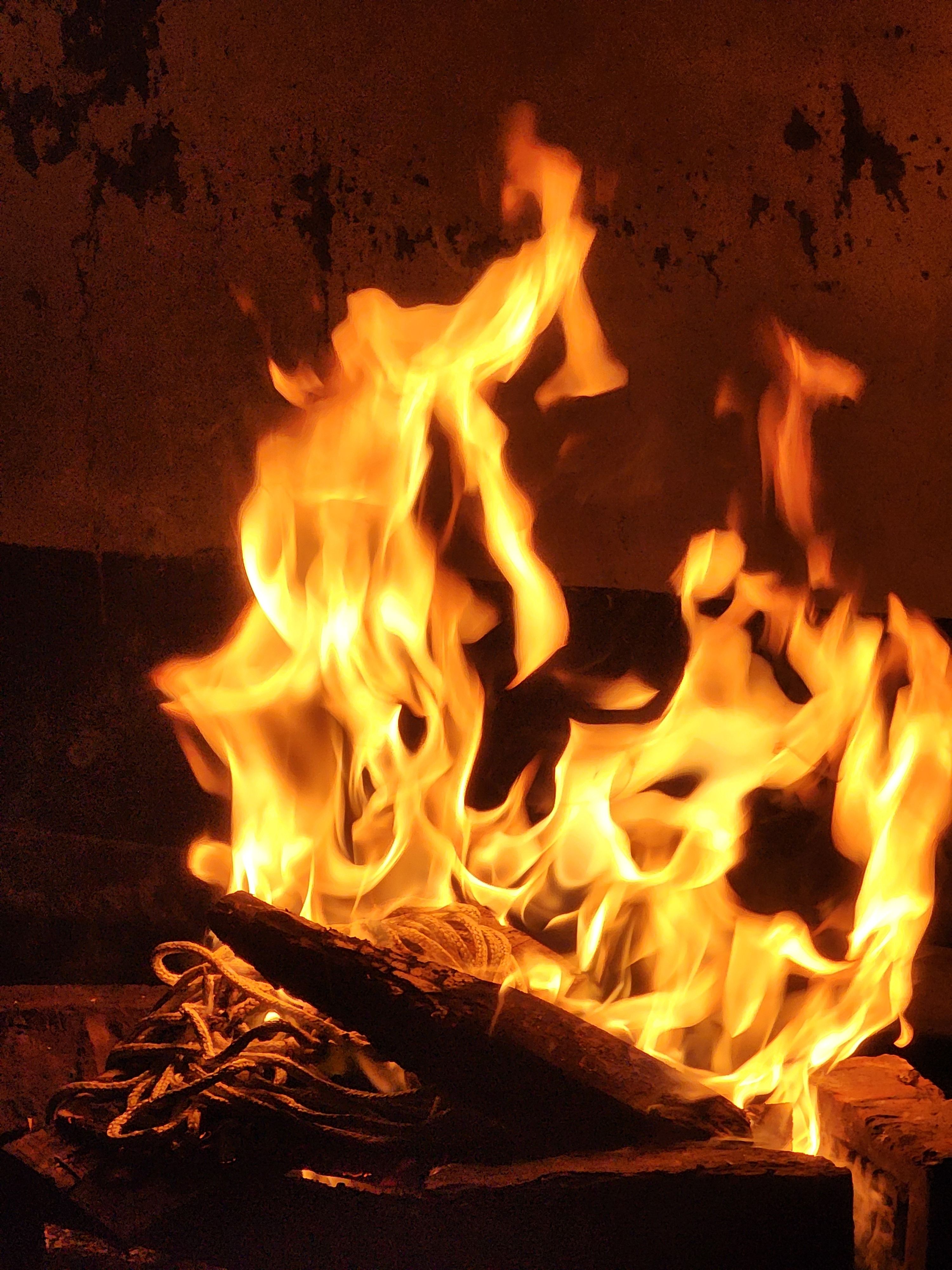 Captivating Flames in Rustic Fireplace Setting · Free Stock Photo