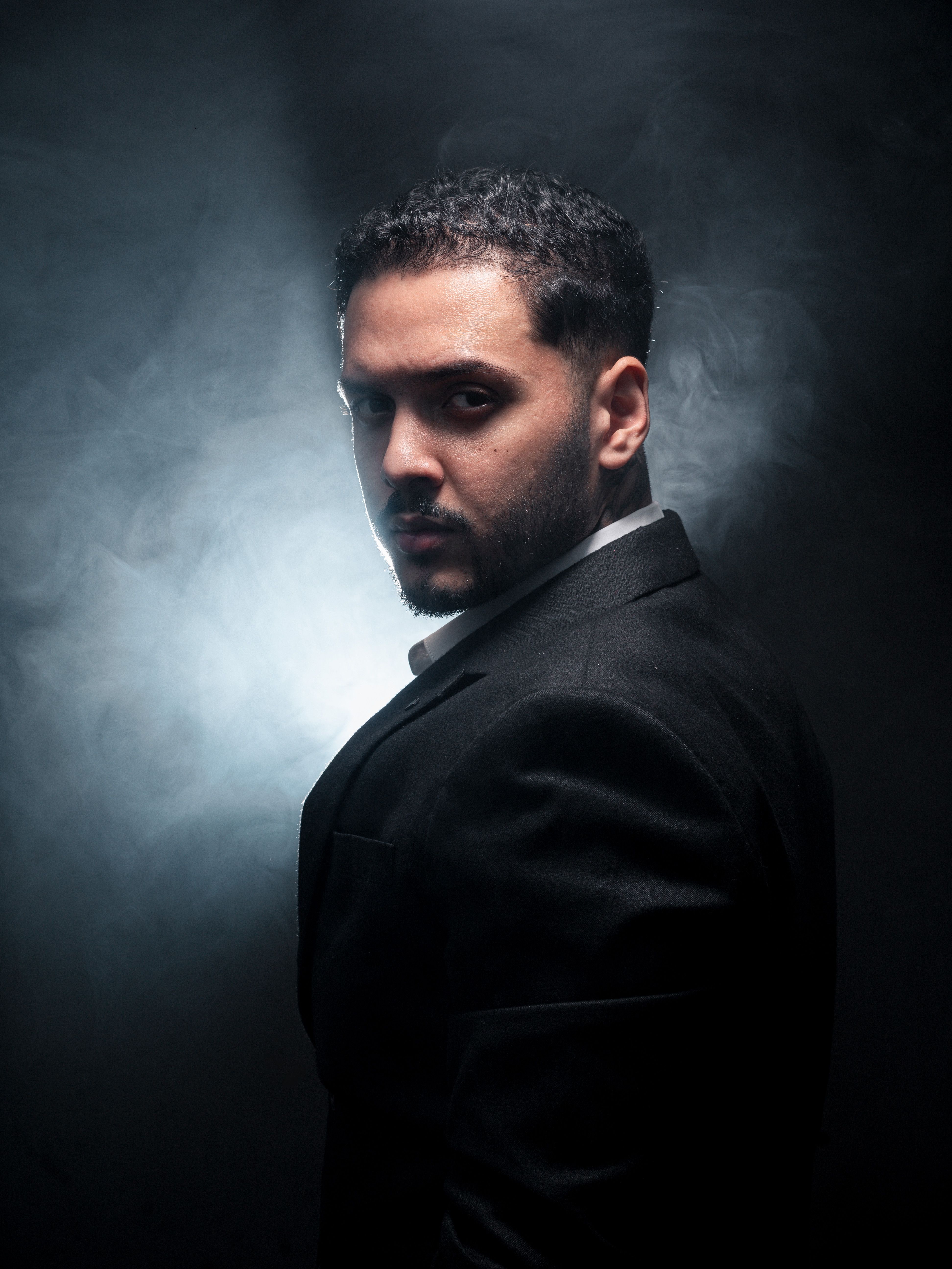 Moody Portrait of Man in Black Suit · Free Stock Photo