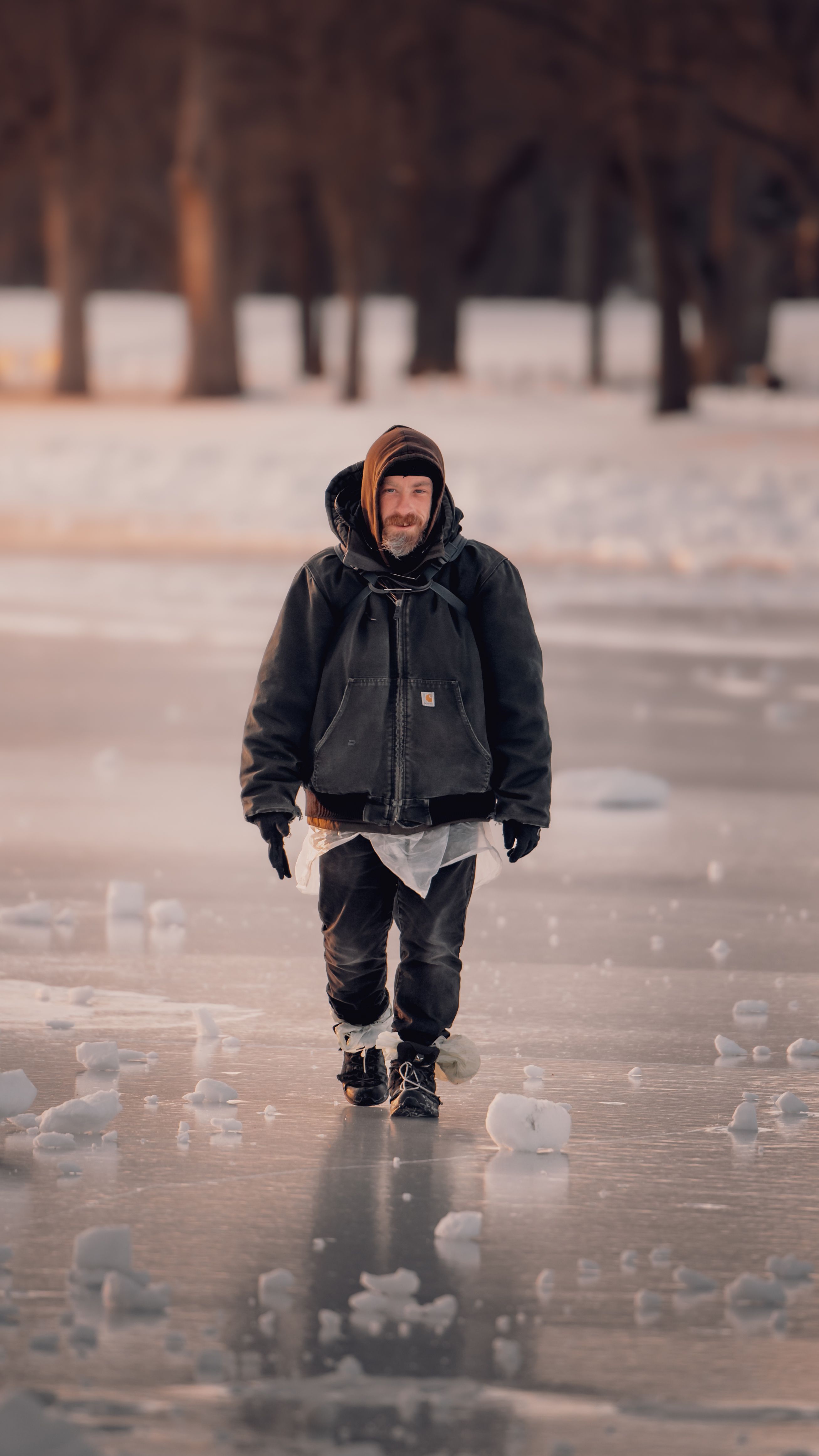 Man Walking on Frozen Lake in Winter · Free Stock Photo