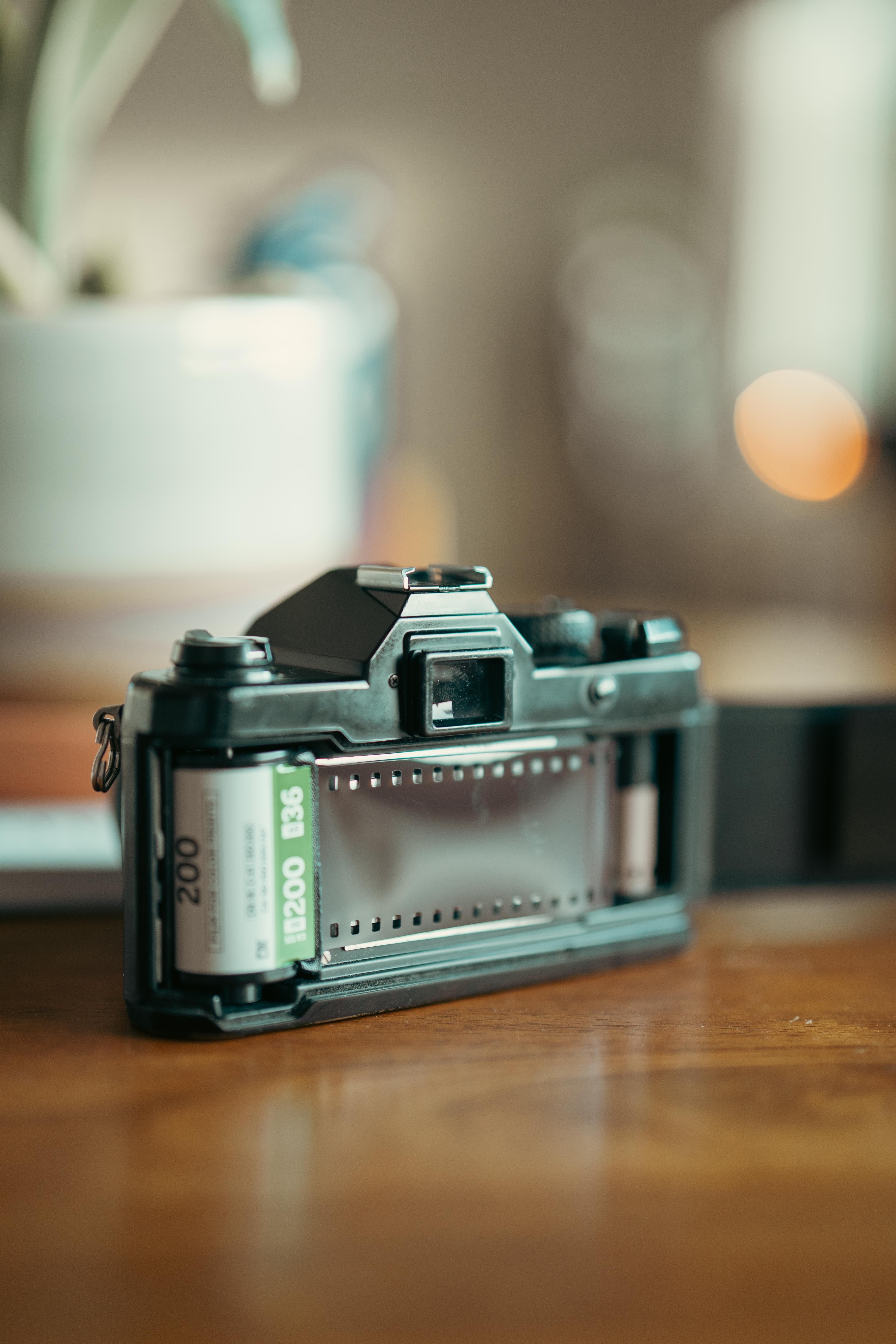 Open SLR Camera with Film Roll Indoors · Free Stock Photo