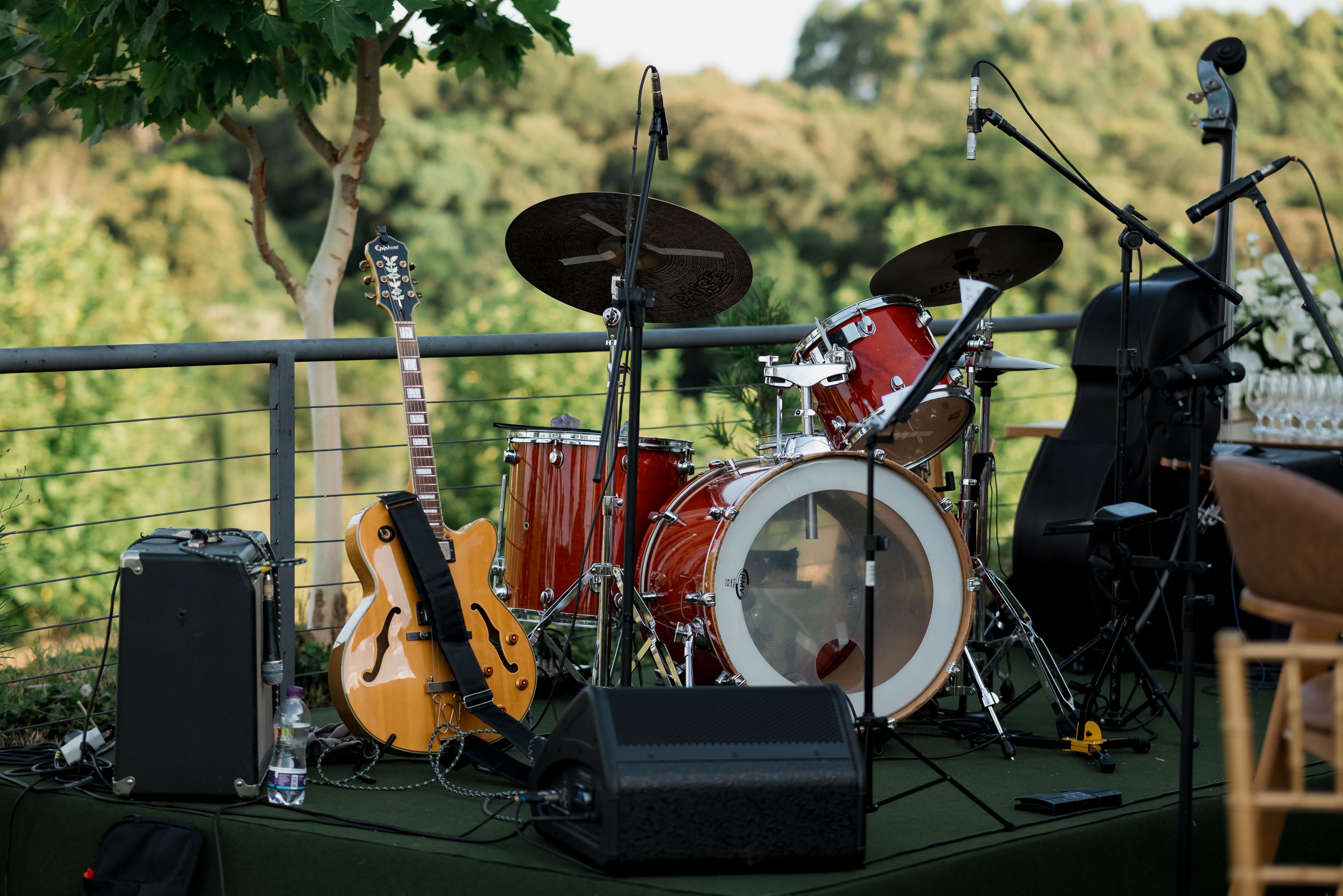 Outdoor Music Stage with Drum Set and Guitar · Free Stock Photo