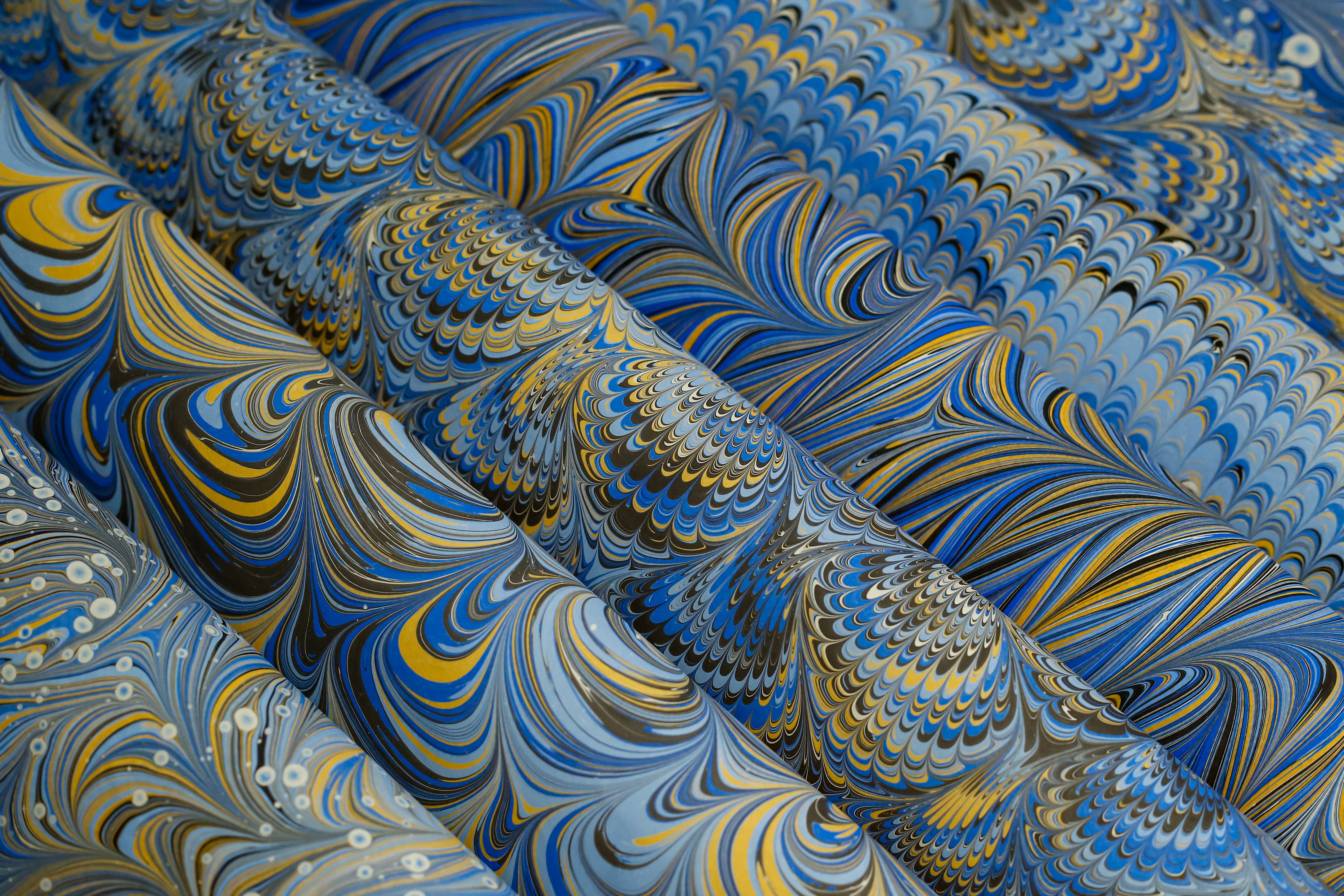 Vibrant Blue and Yellow Marbled Paper Pattern Close-up · Free Stock Photo