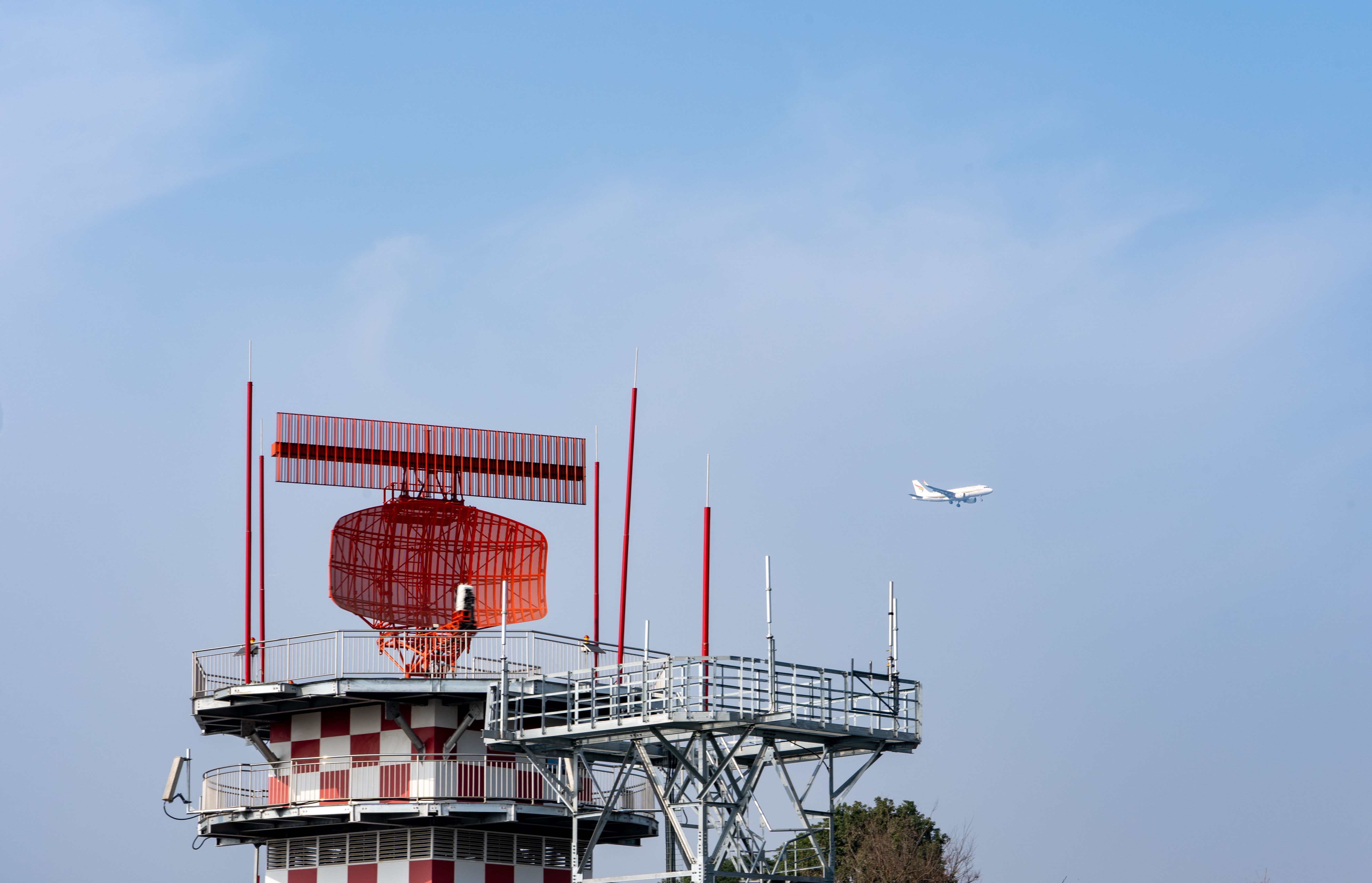Airport Radar Tower with Airplane in Sky · Free Stock Photo