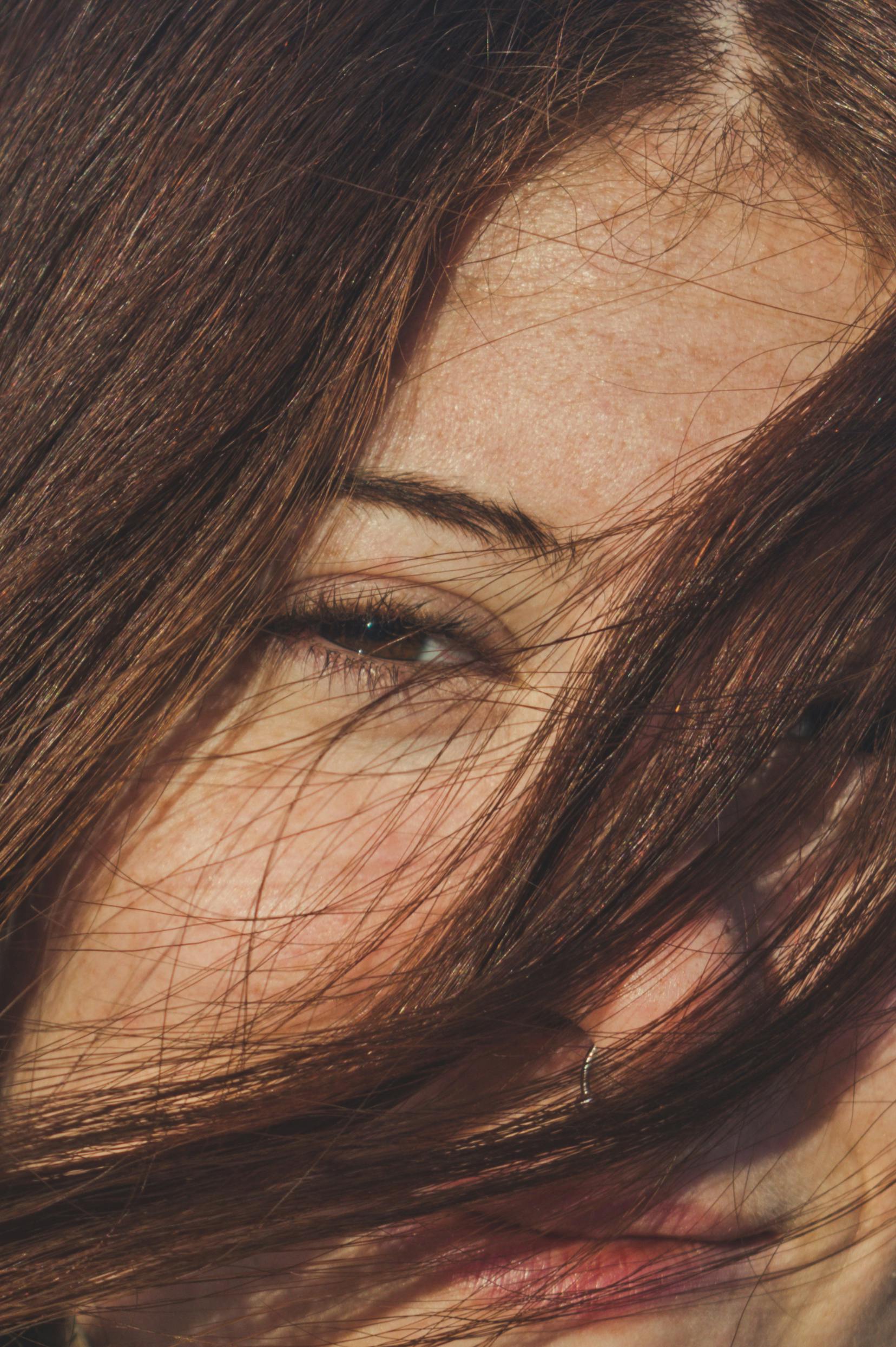 A Face Covered with Hair · Free Stock Photo