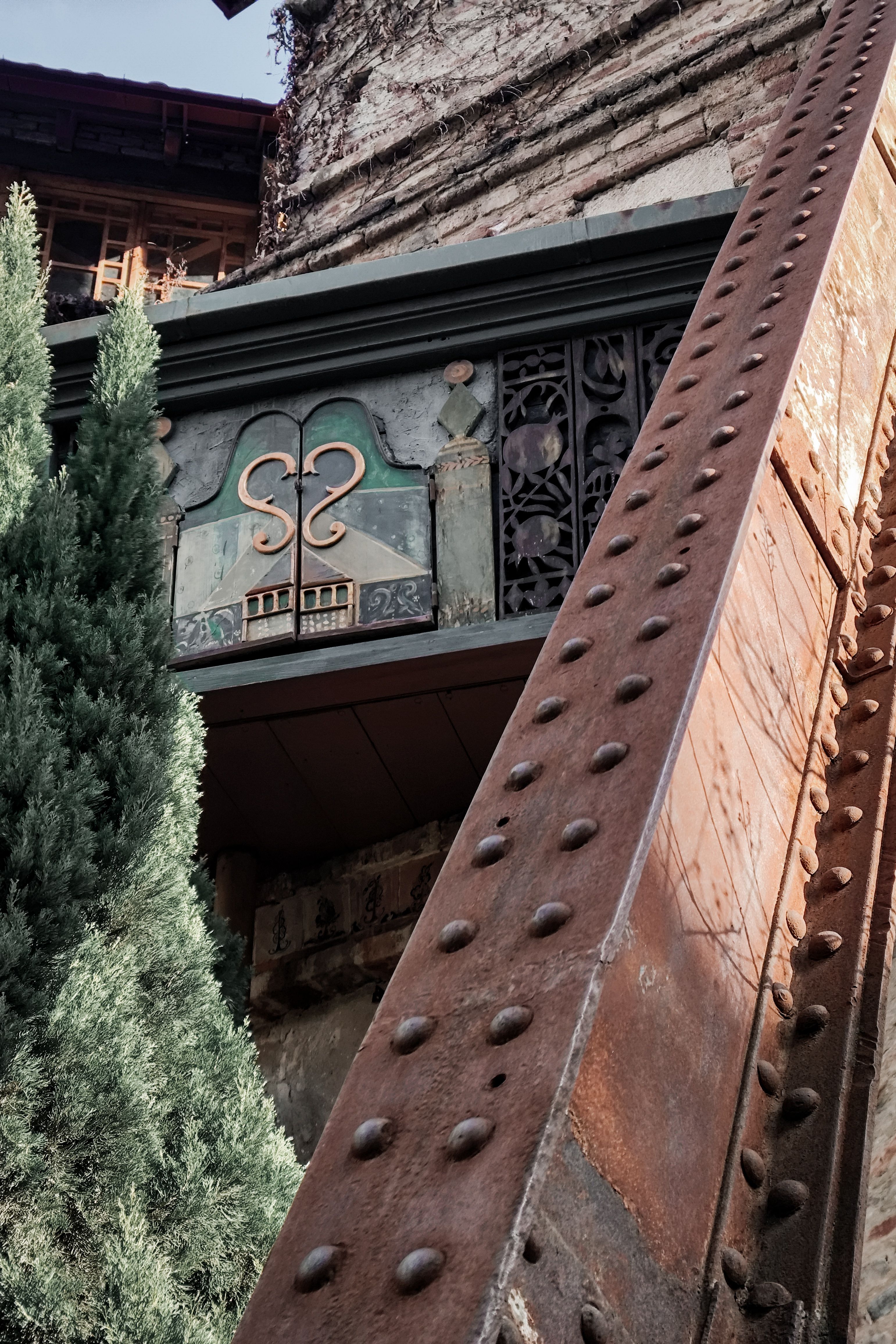 Wooden Signage on Stone Wall · Free Stock Photo
