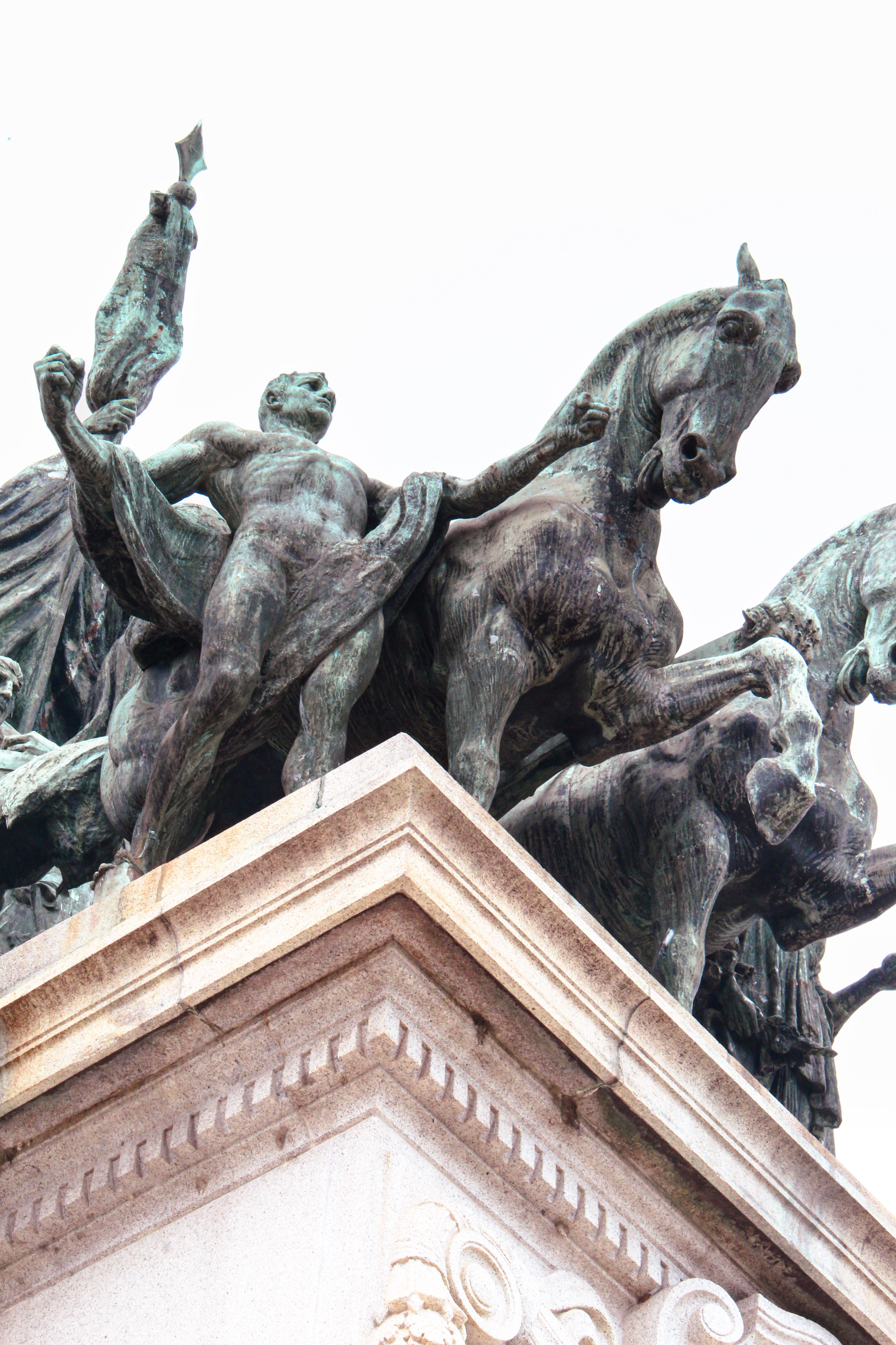 Dramatic Bronze Sculpture on Monument Base · Free Stock Photo