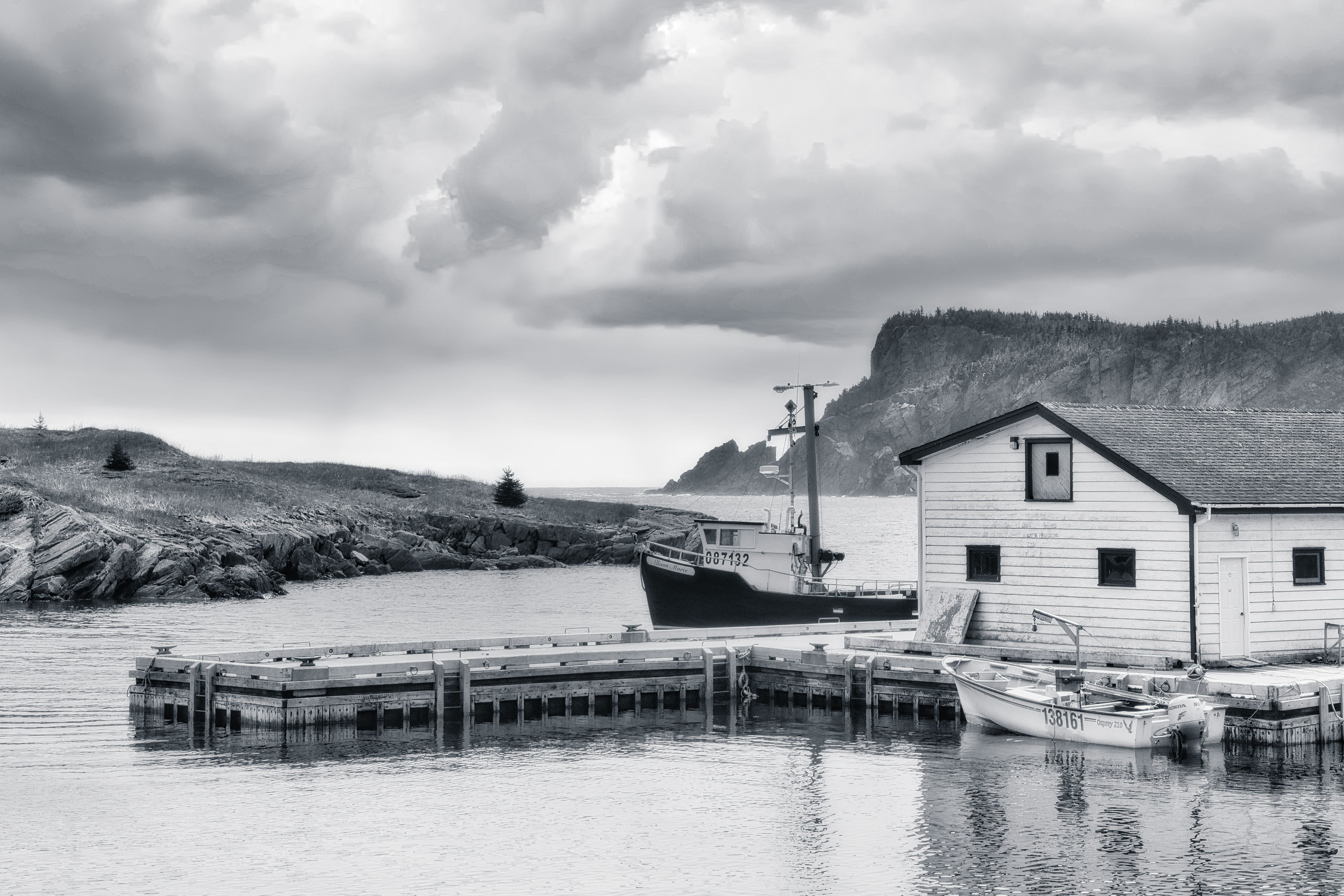 Monochrome Coastal Scene with Boats and Dock · Free Stock Photo