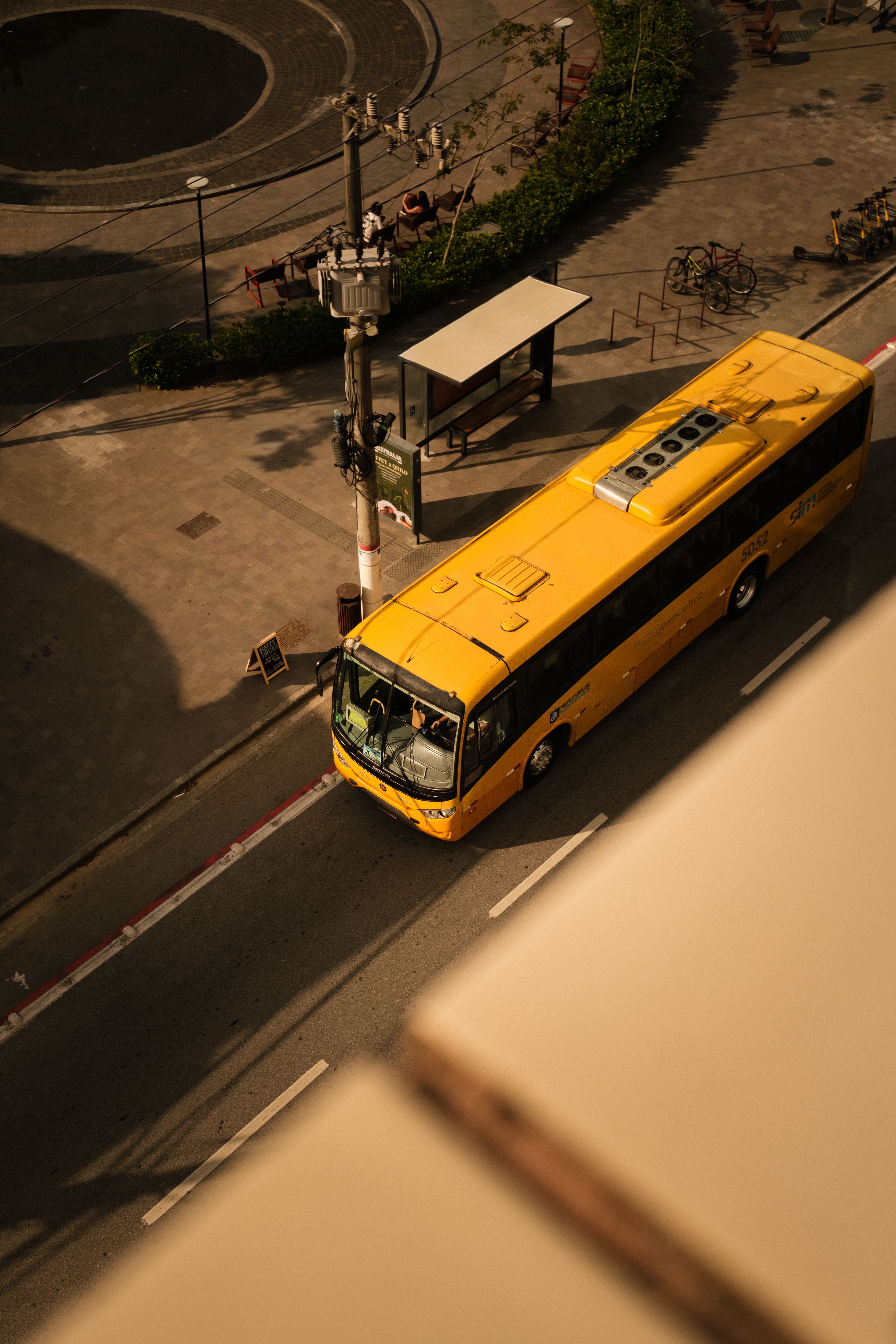 Aerial View of Yellow Bus on City Street in Brazil · Free Stock Photo