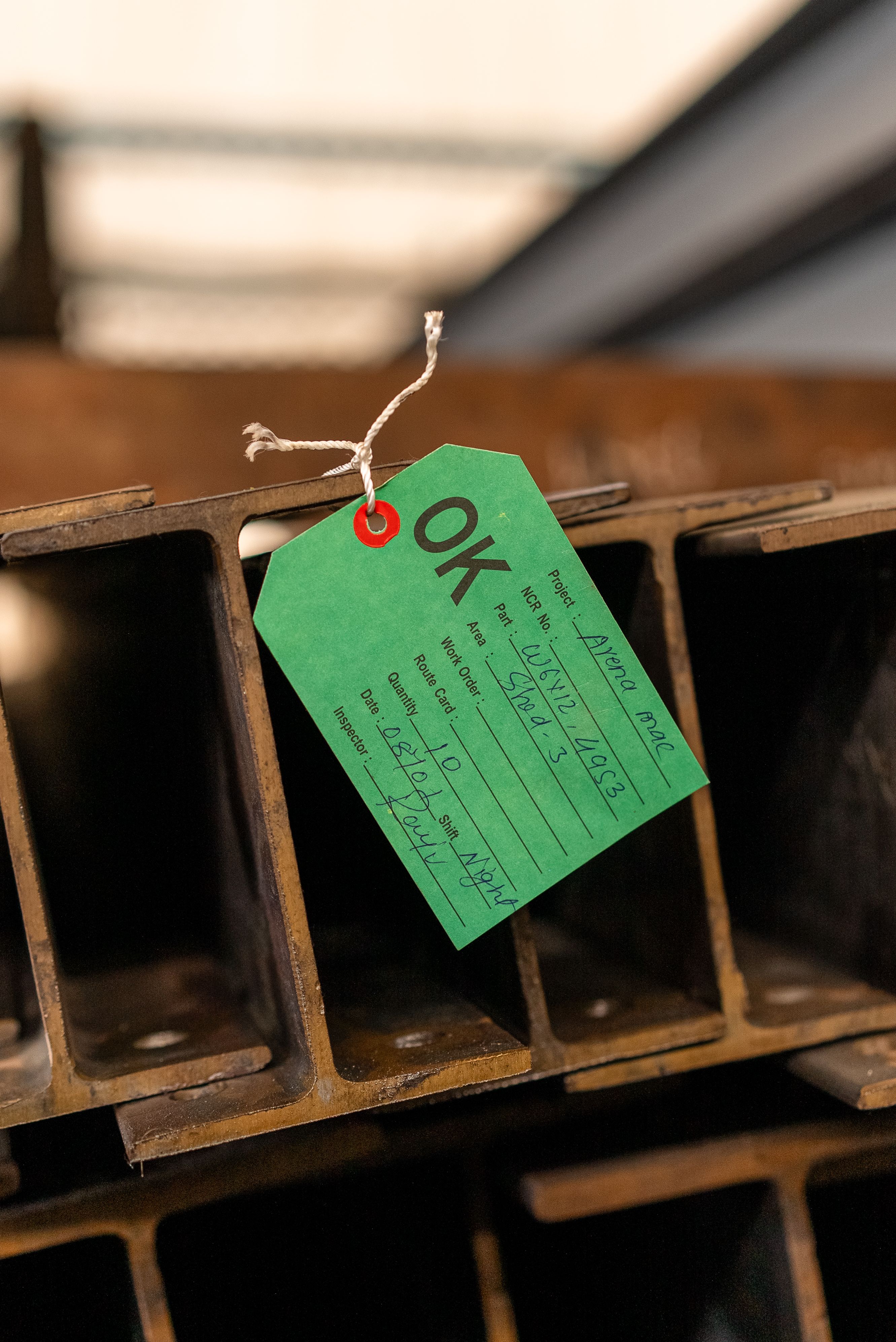 Close-up of Steel Beam with Inspection Tag · Free Stock Photo