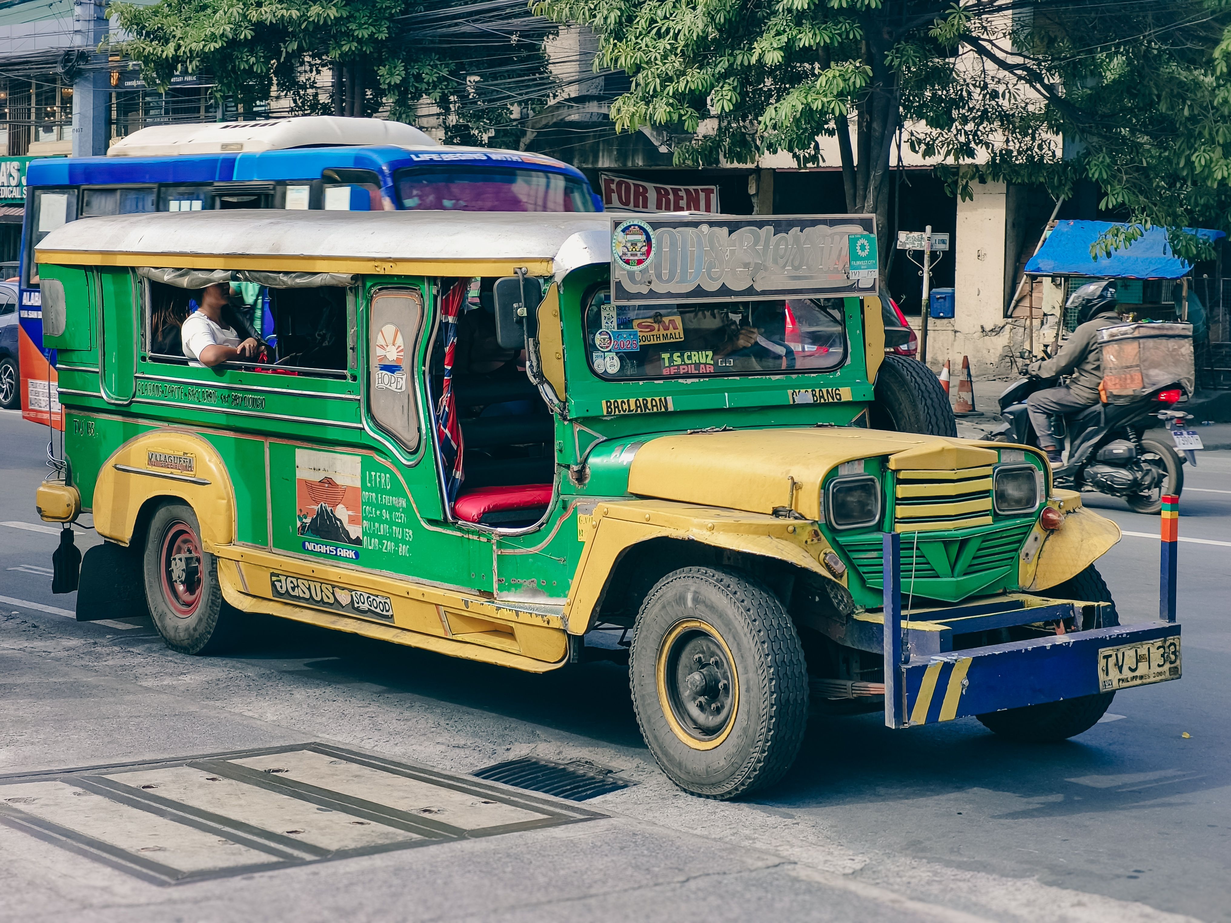 Colorful Jeepney in Urban Philippine Street · Free Stock Photo