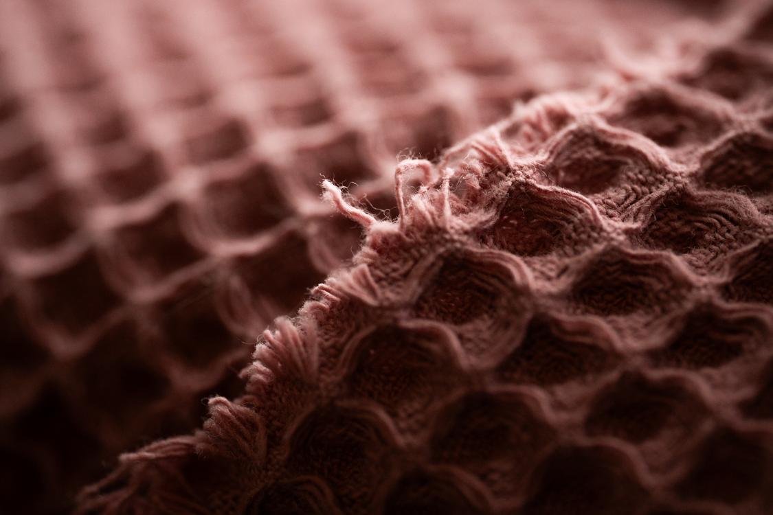 Close-up of Textured Pink Fabric in Soft Light · Free Stock Photo