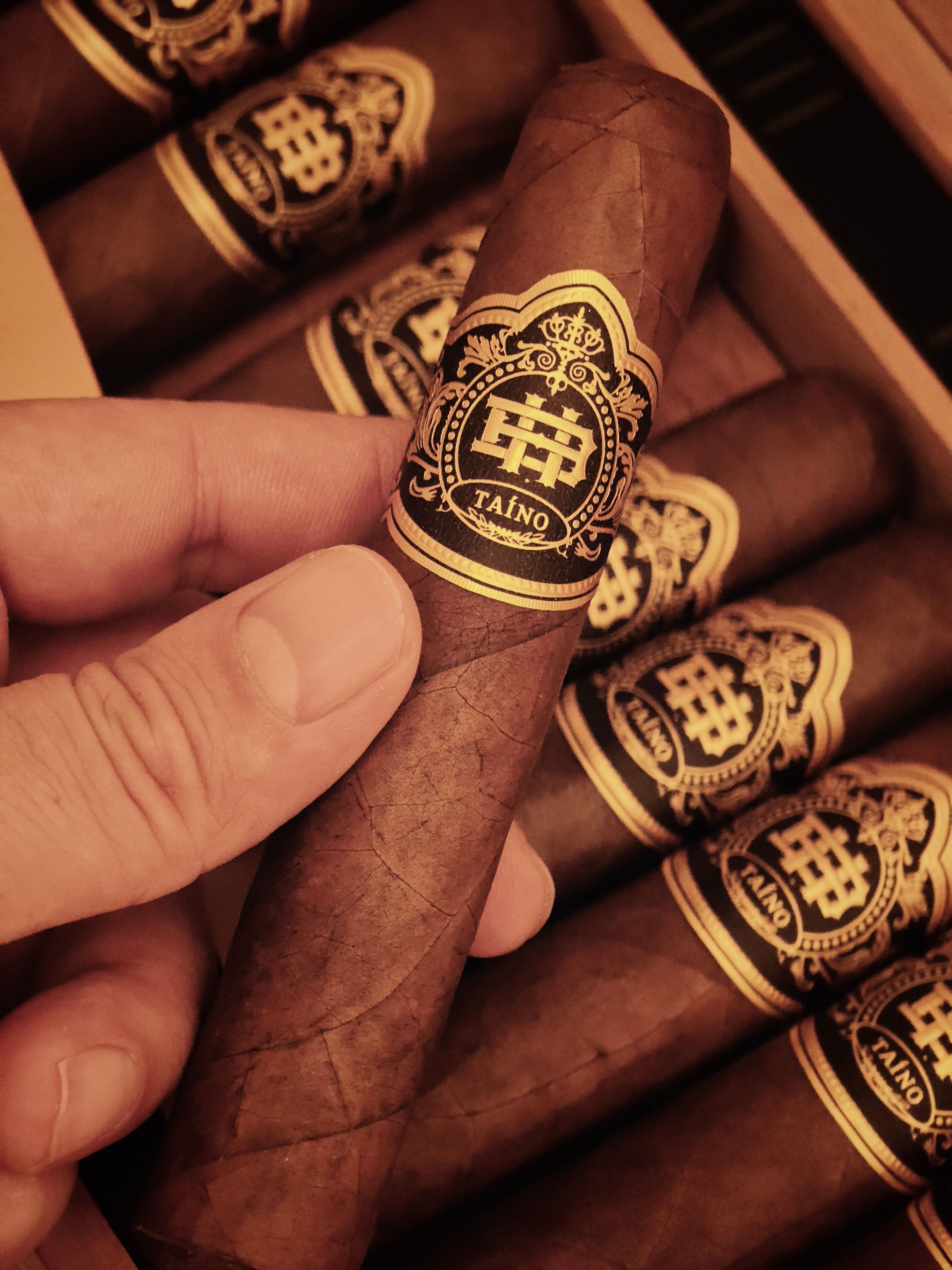 Luxury Cigars in Hand with Elegant Packaging · Free Stock Photo