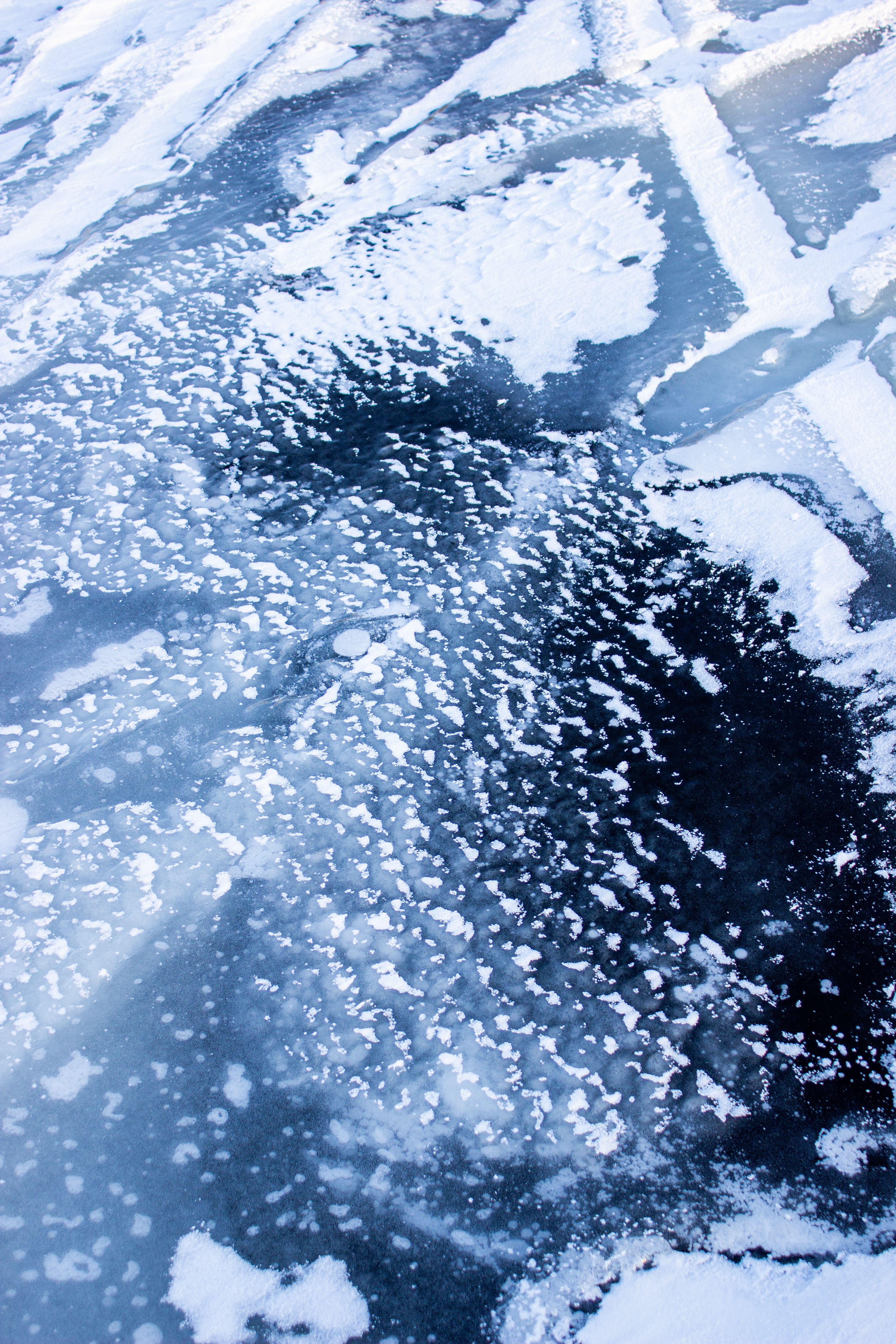 Abstract Frozen Ice Surface with Snow Patterns · Free Stock Photo