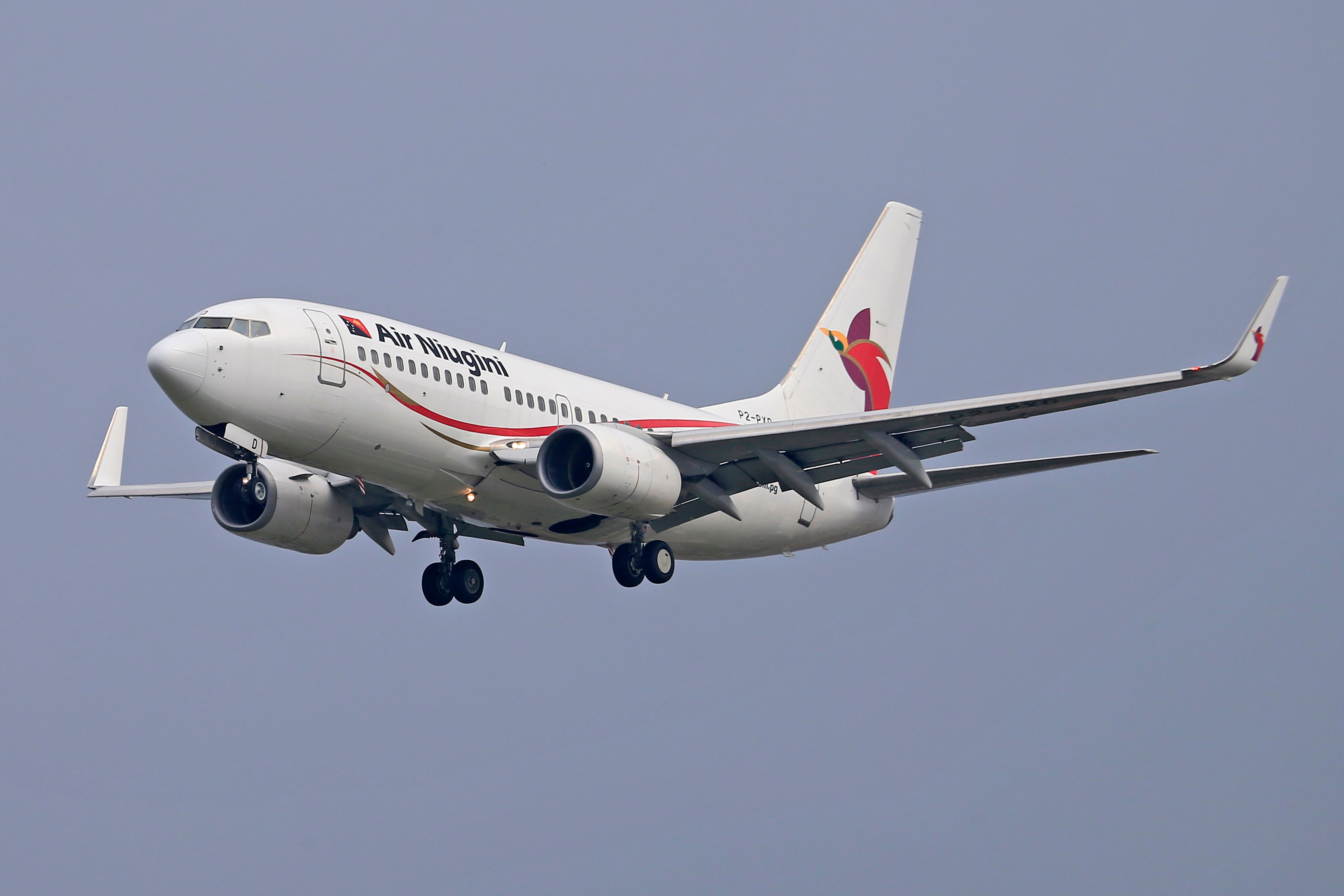 Air Niugini Boeing 737-700 in Flight Closeup · Free Stock Photo