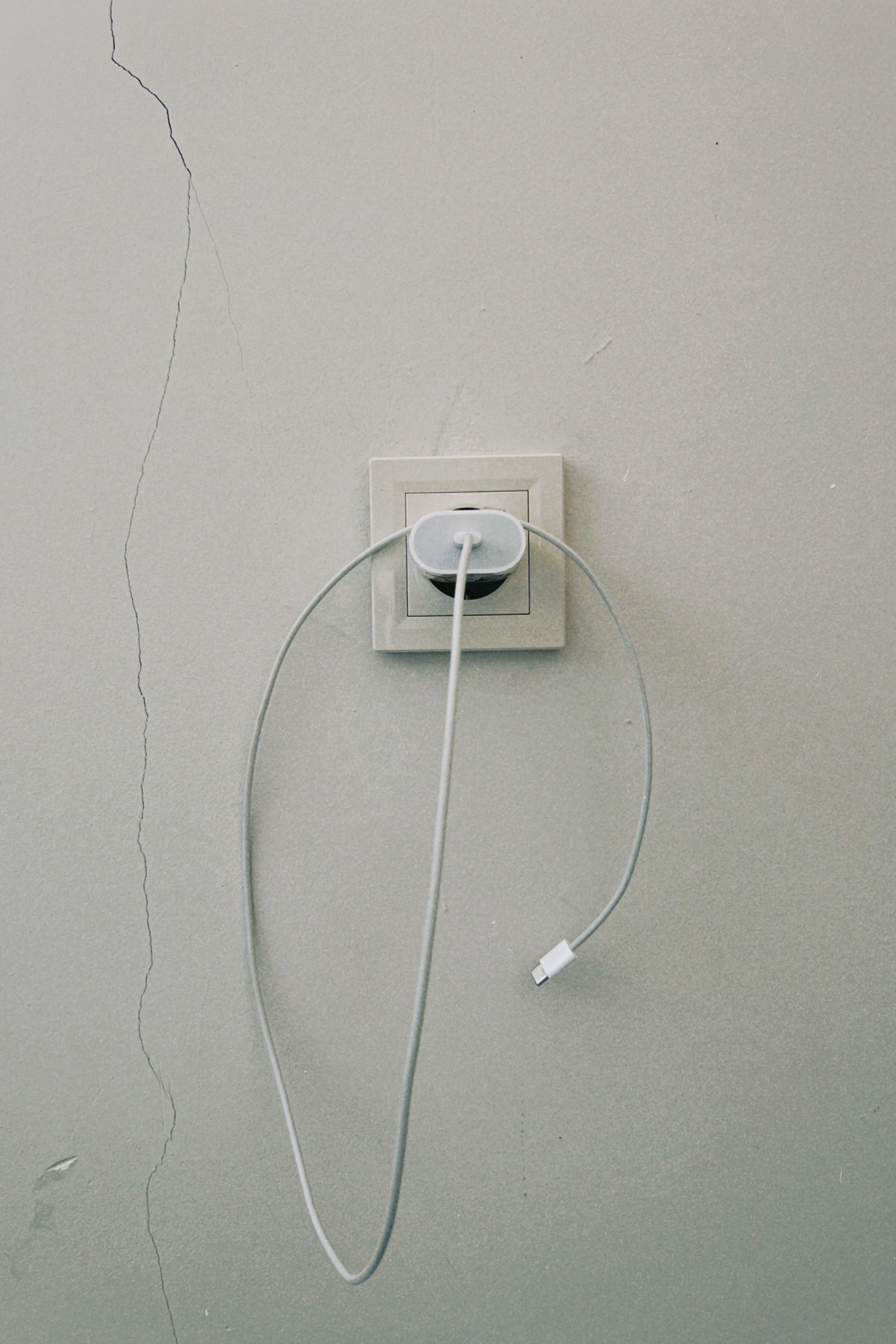 Minimalist Wall Socket with Charging Cable · Free Stock Photo